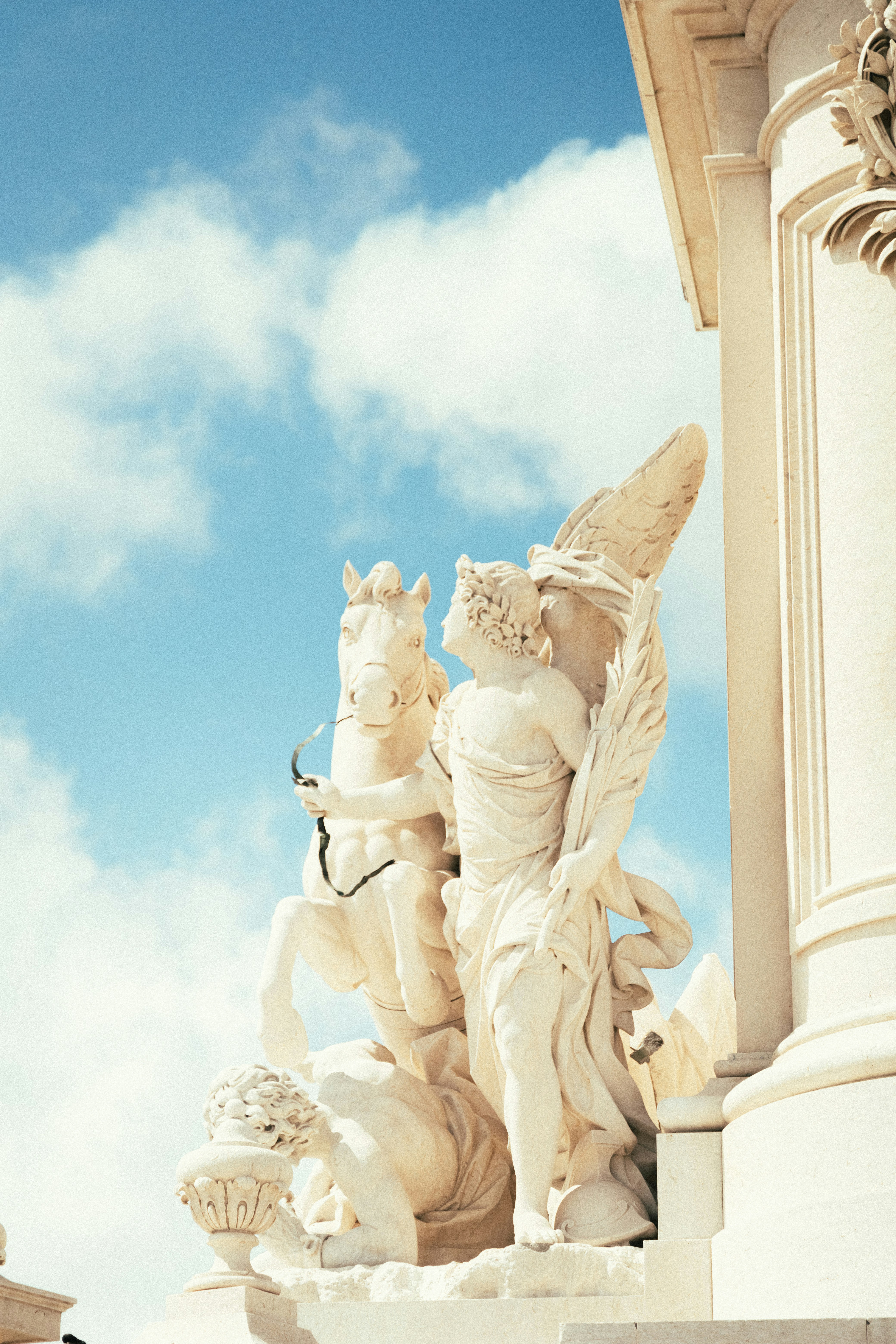 Cerulean Sky, Marble Sentinel: Winged Figure on a Horse