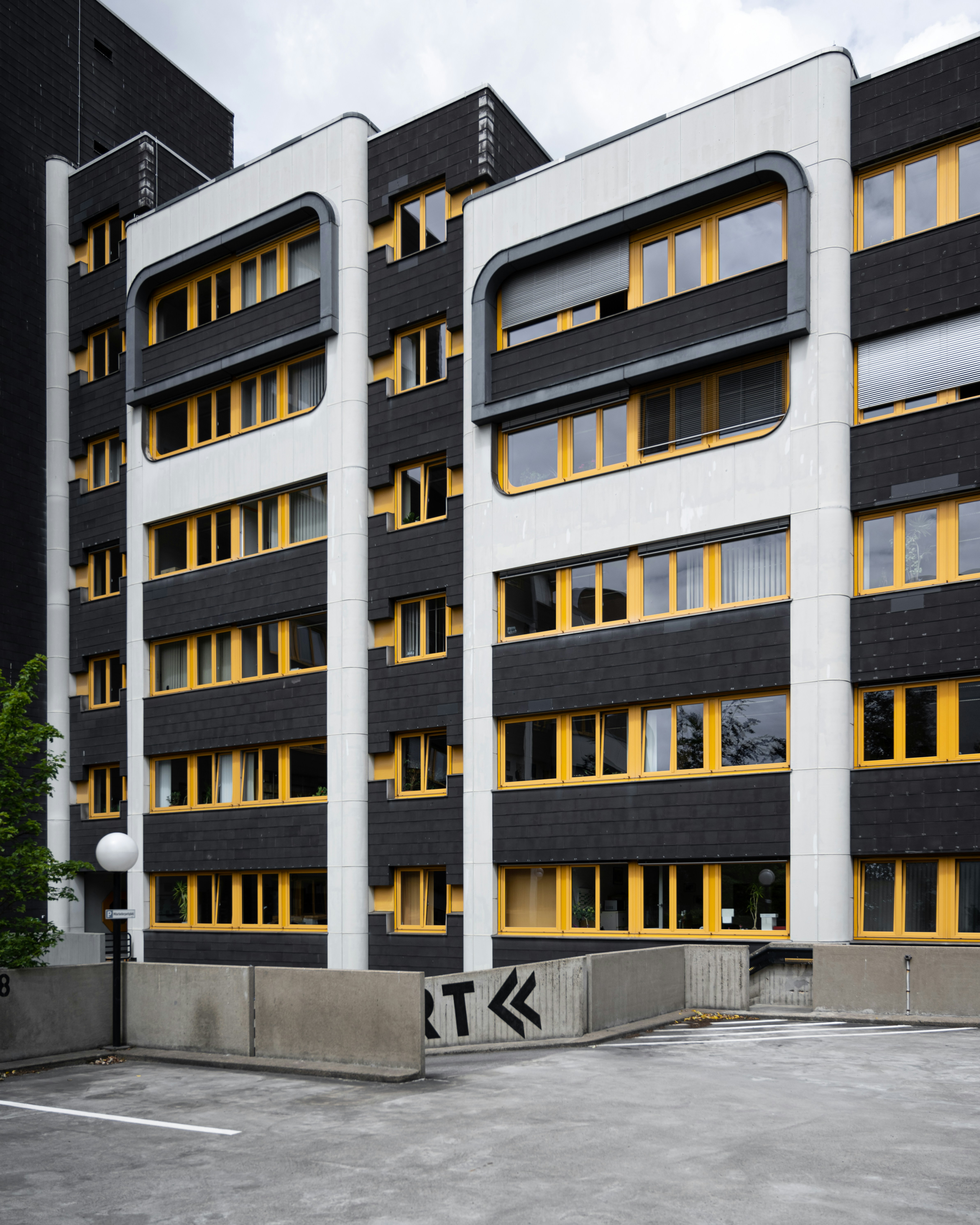 Yellow-Framed Facade: A Modern Geometry of Windows and Curves