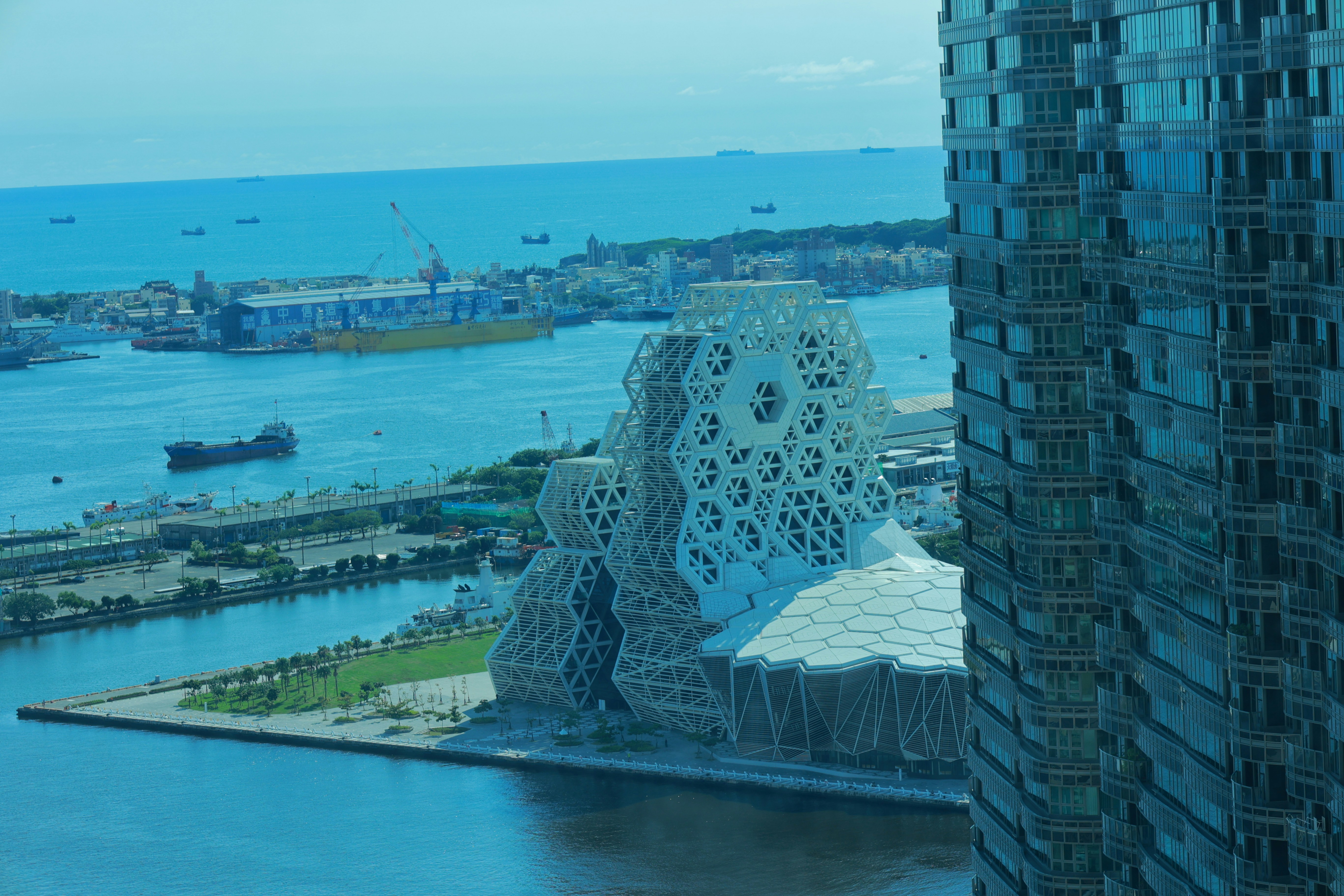 Hexa Harbor: Honeycomb Spine Framing a Waterfront Skyline