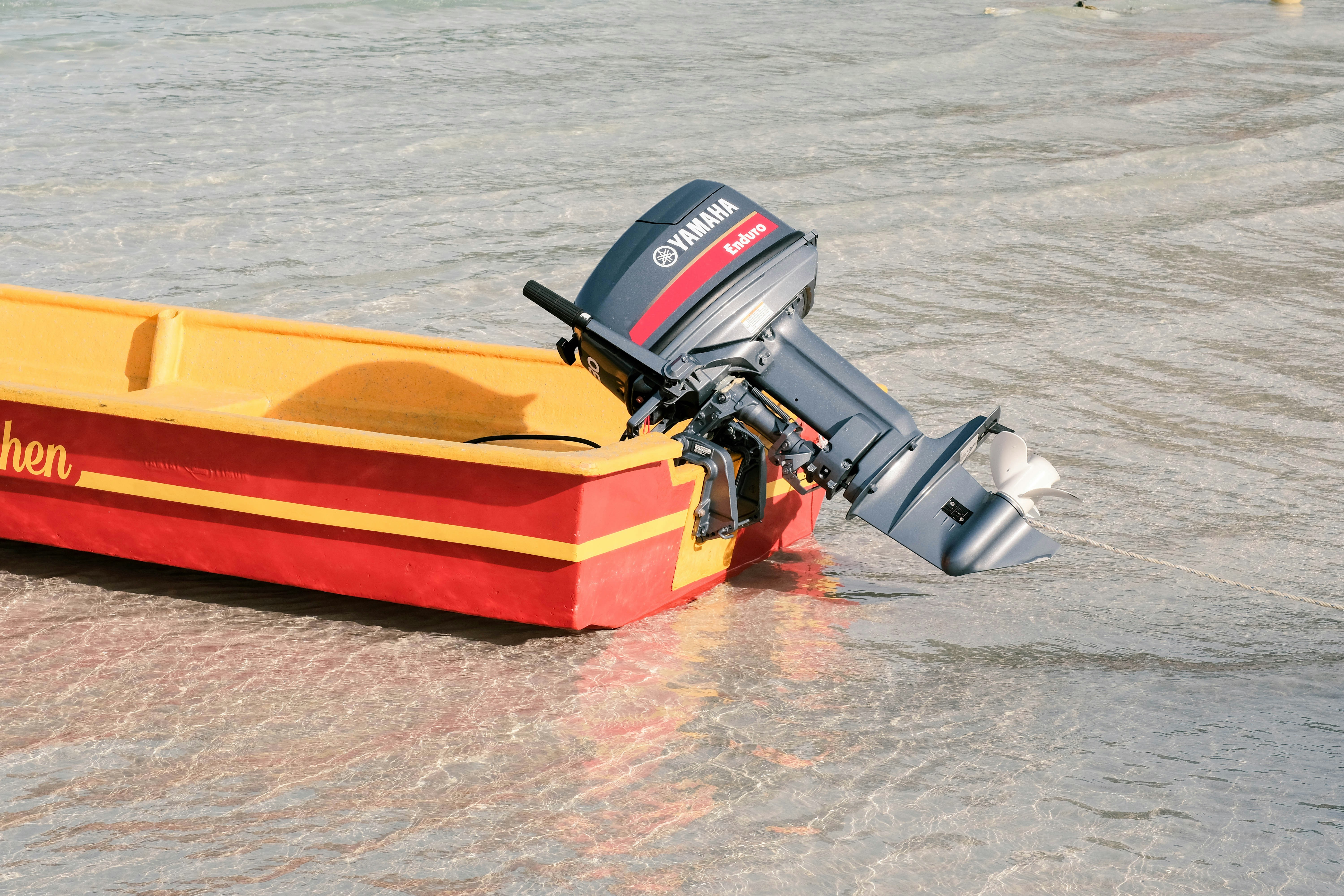 Yamaha on the Tide: a sunlit dinghy resting on glistening sand