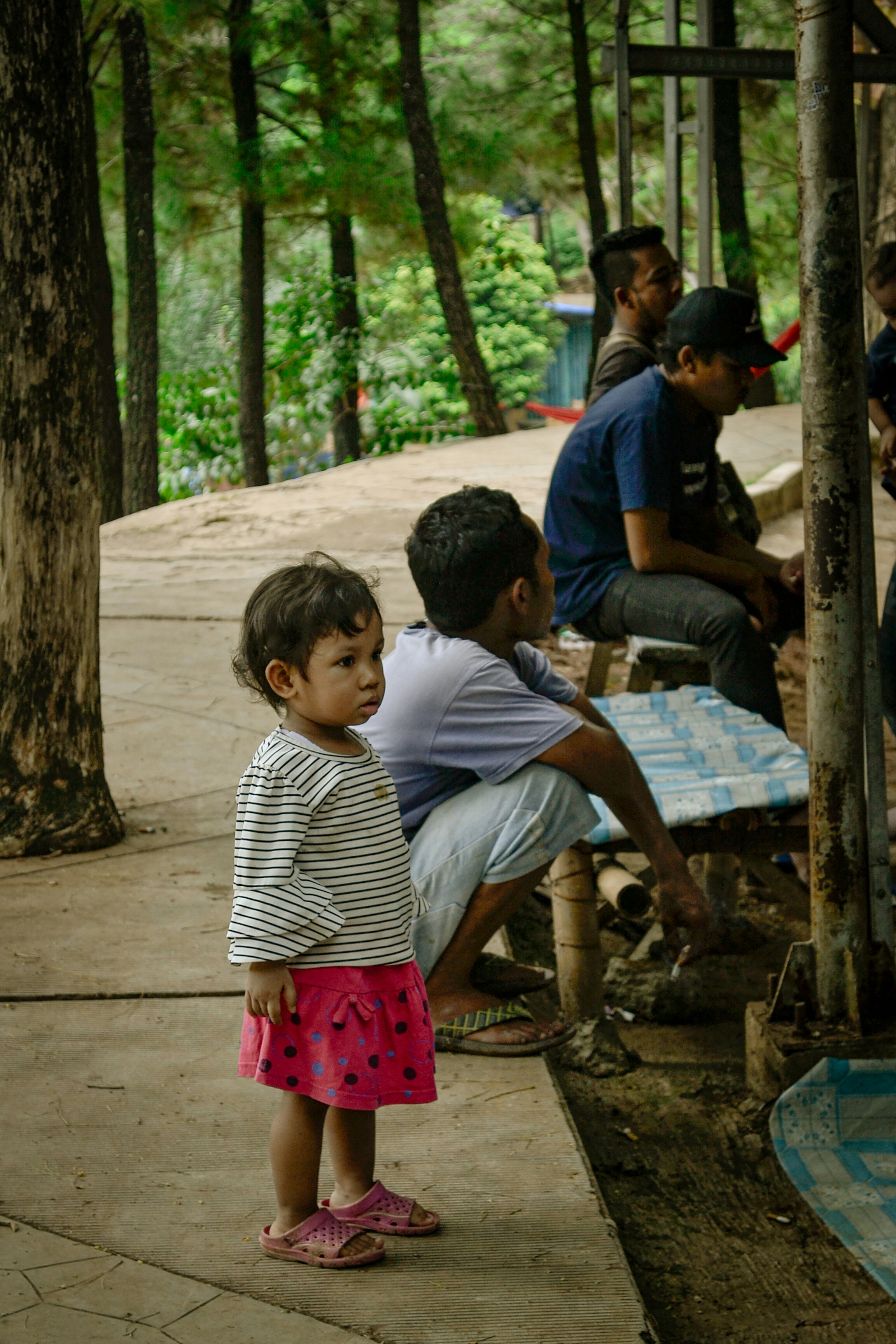 A group of people sitting on a bench photo – Free Taman kota 2 bsd ...