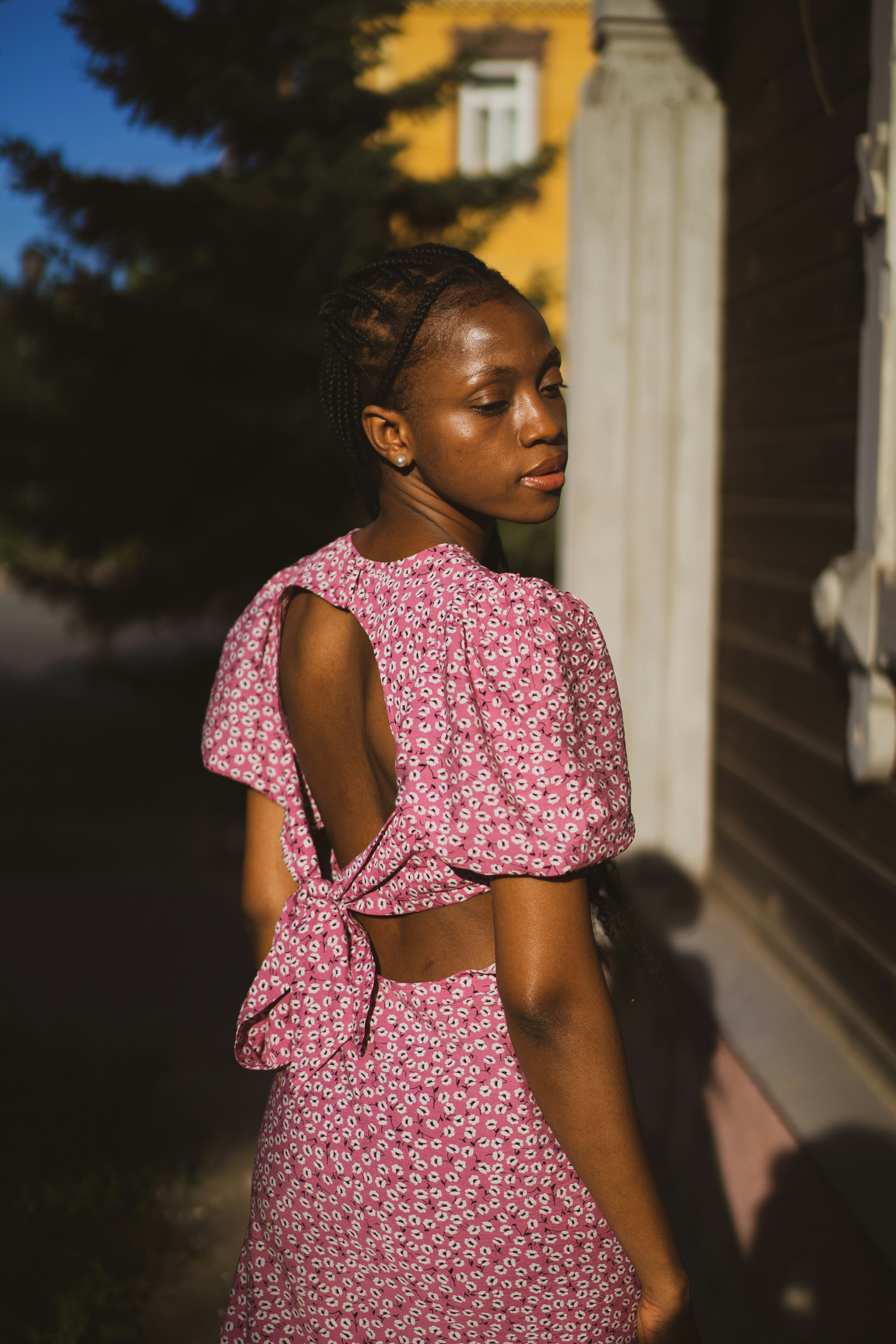 Warm Portrait in Pink Florals: Quiet Confidence by the Porch