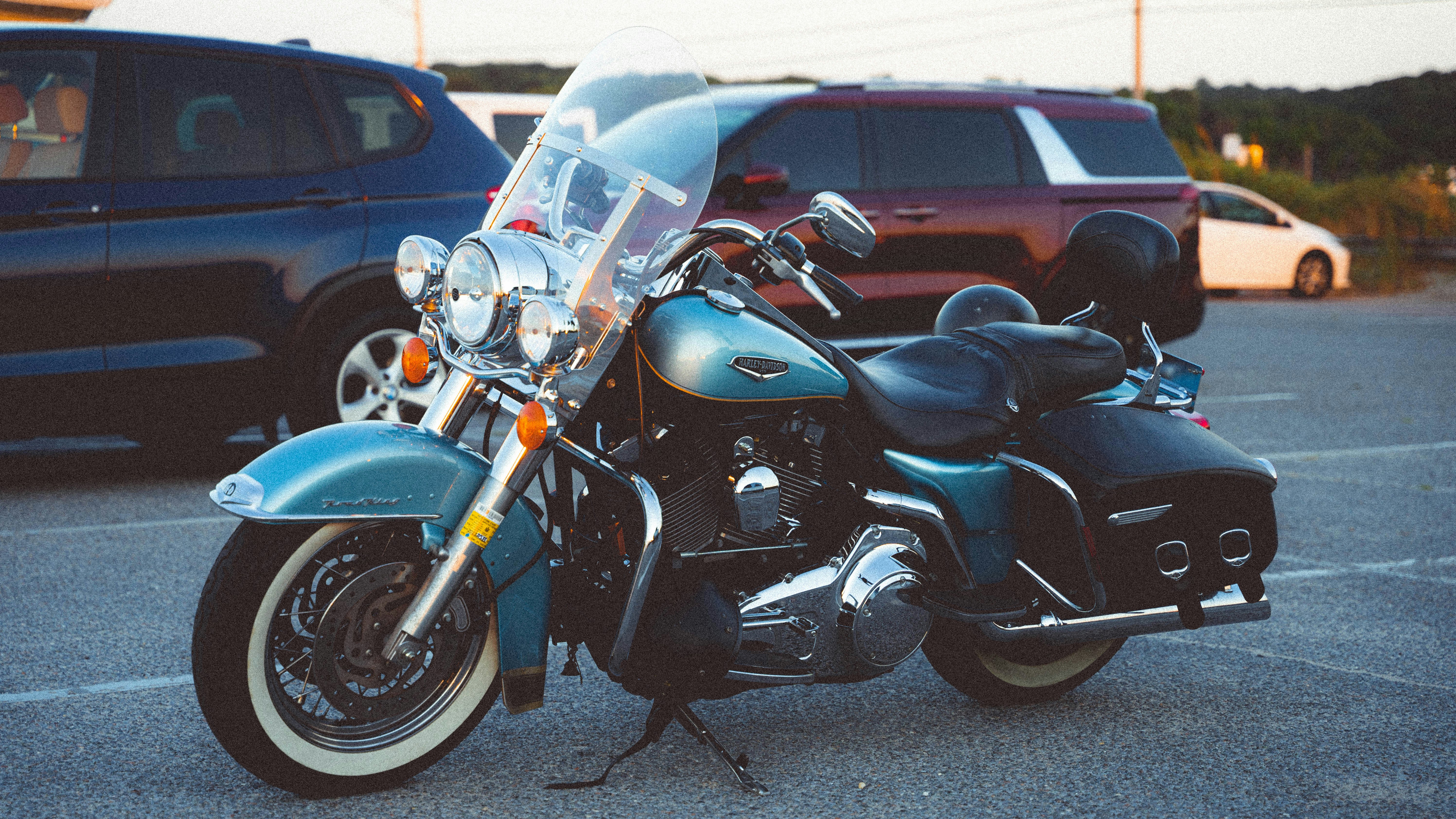 Blue-Green Touring Motorcycle in a Quiet Parking Lot