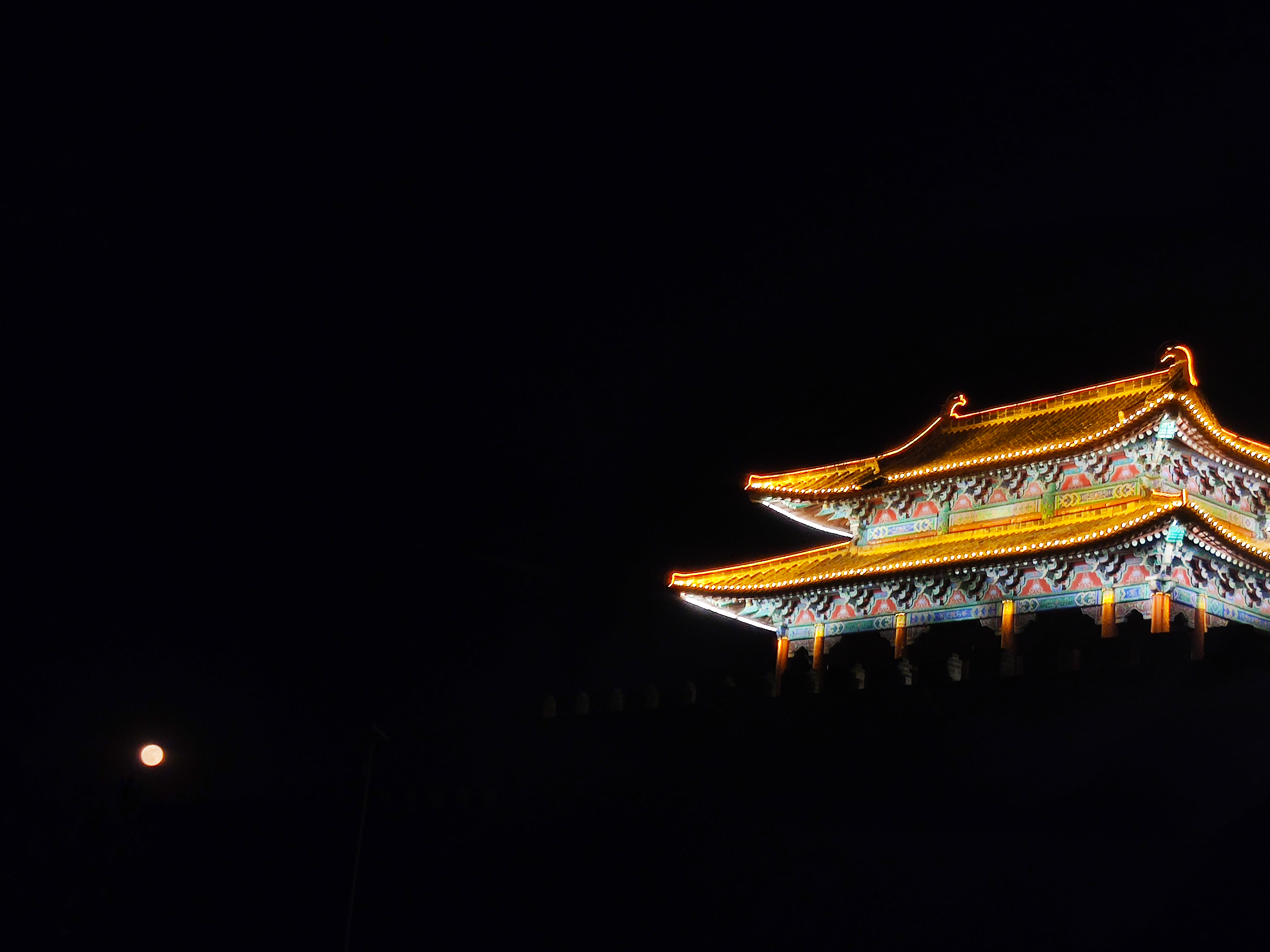 A building with a bright light at night photo – Free Building Image on ...