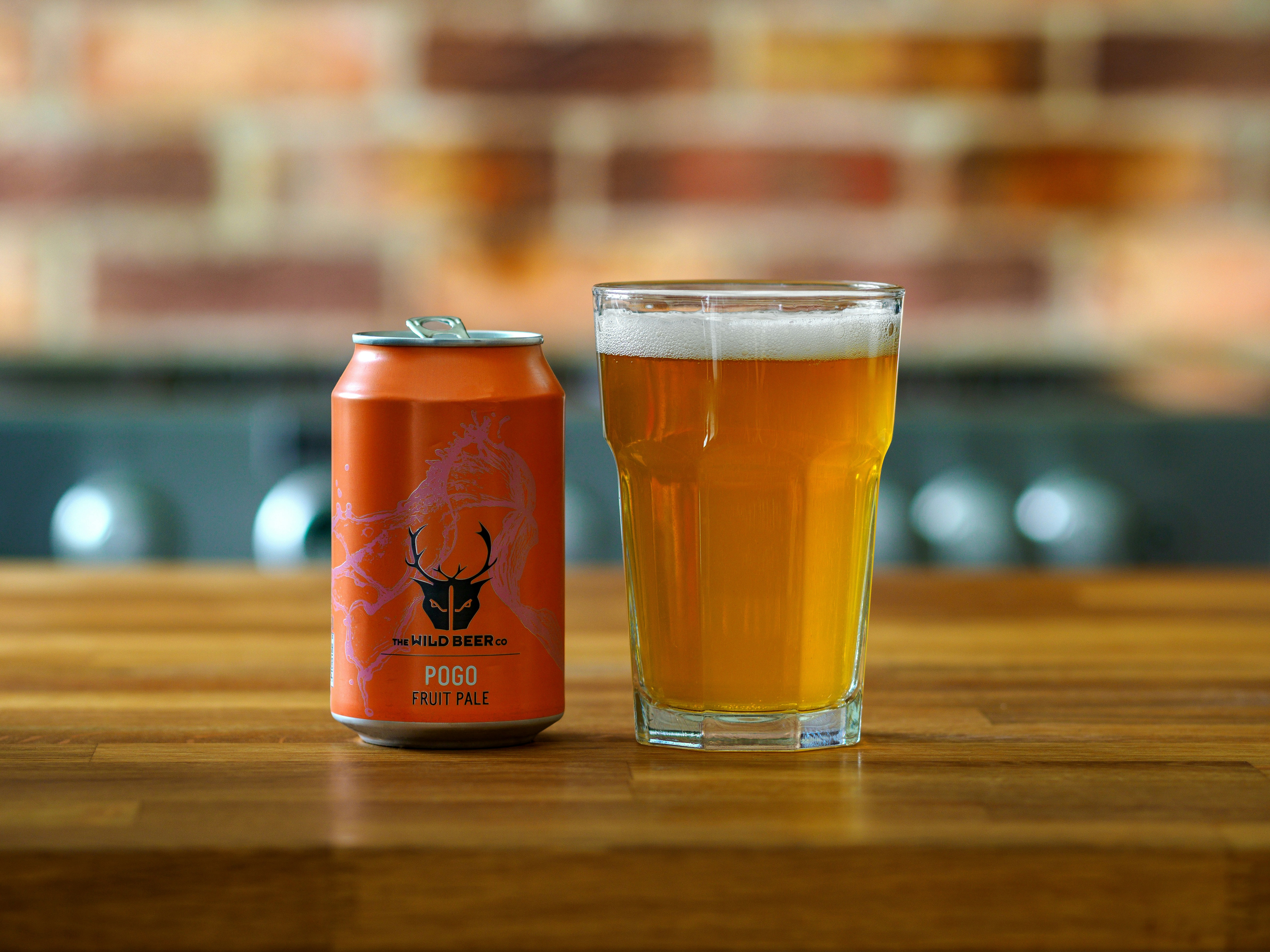 Amber Hour on a Wooden Bar: Copper Can and Golden Pint