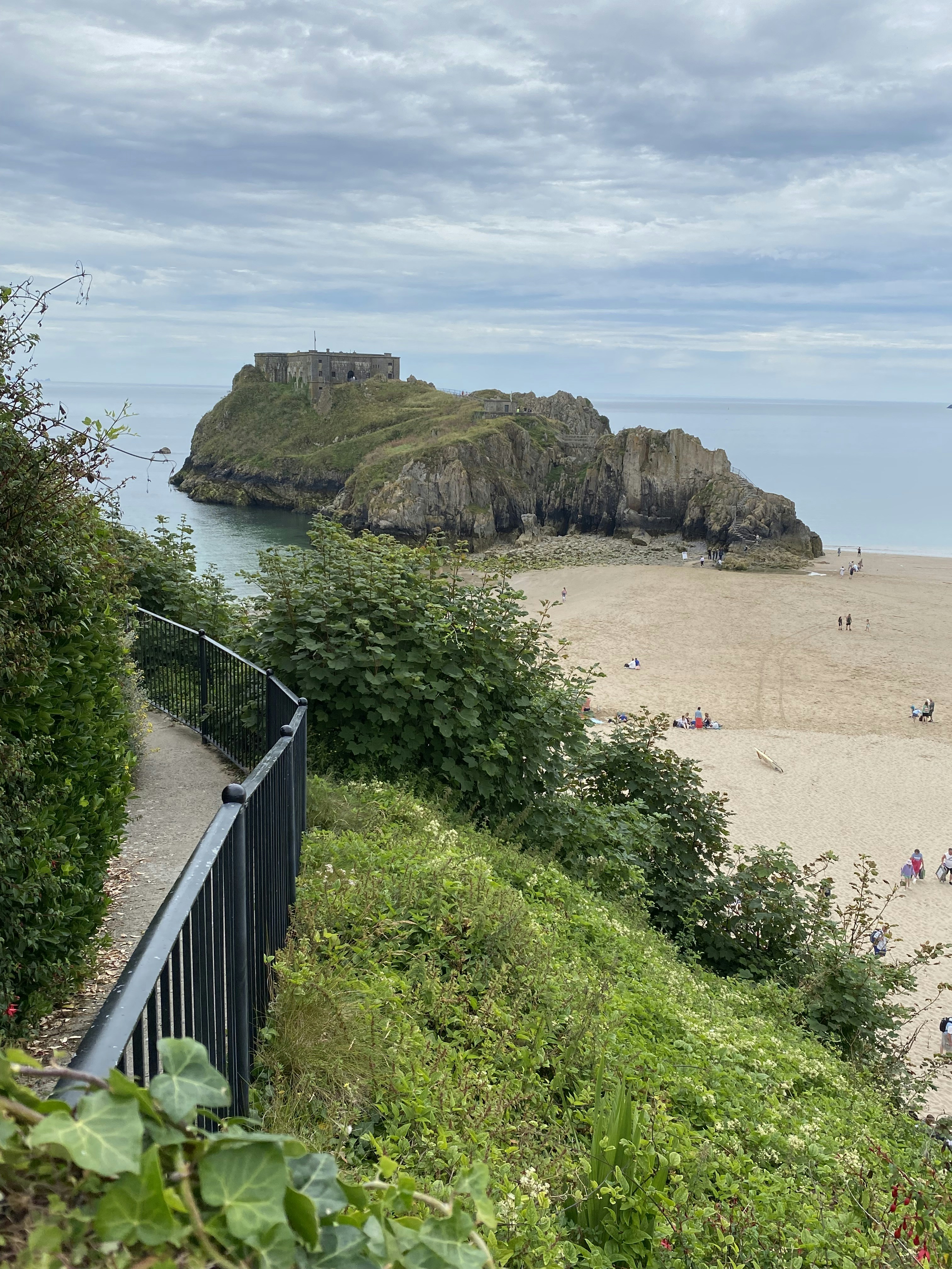 Cliffs and Fortress Overlooking a Sandy Inlet