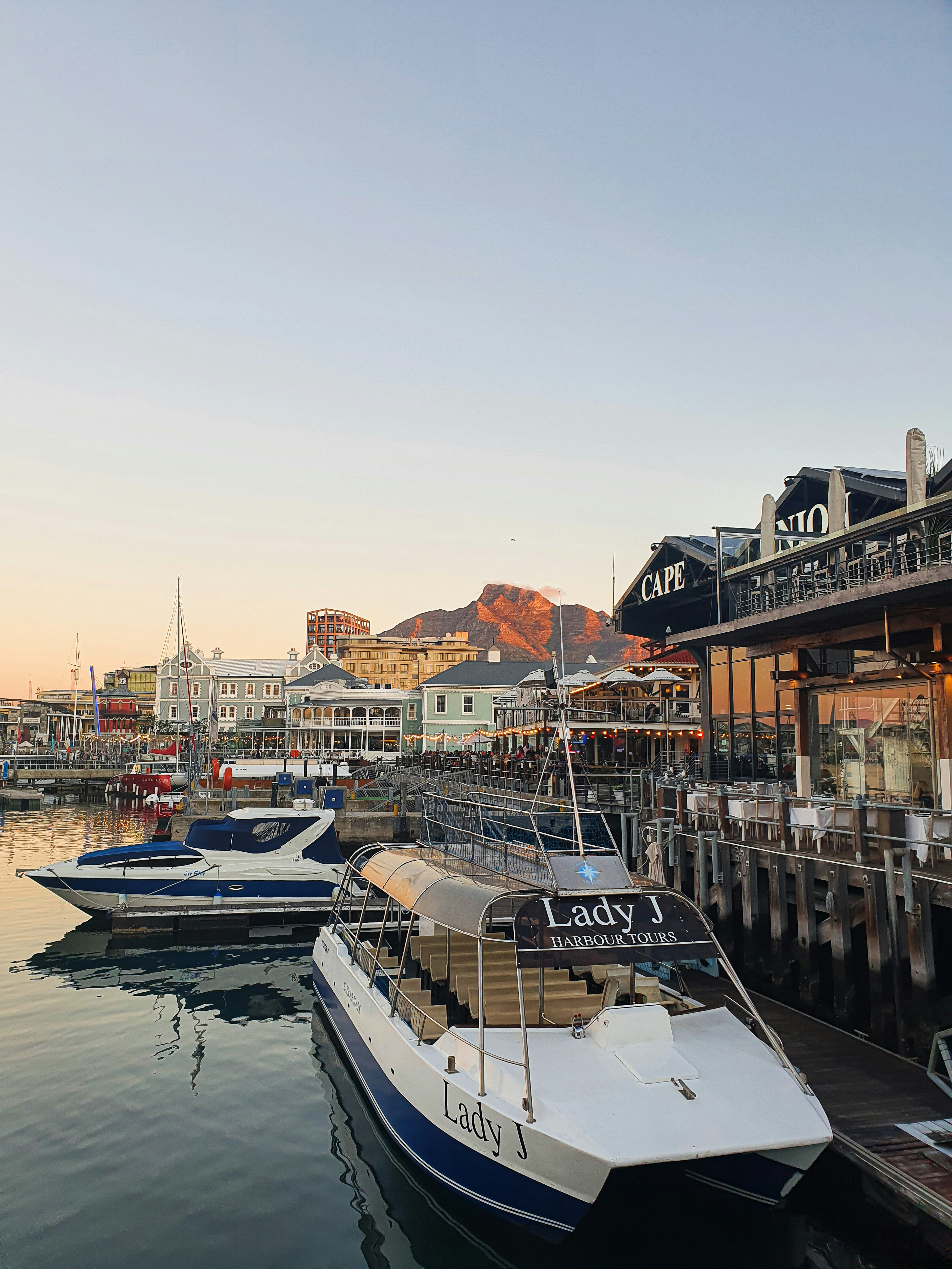 Harbor of Pastel Light: The Lady J at the Edge of Sunset Pier