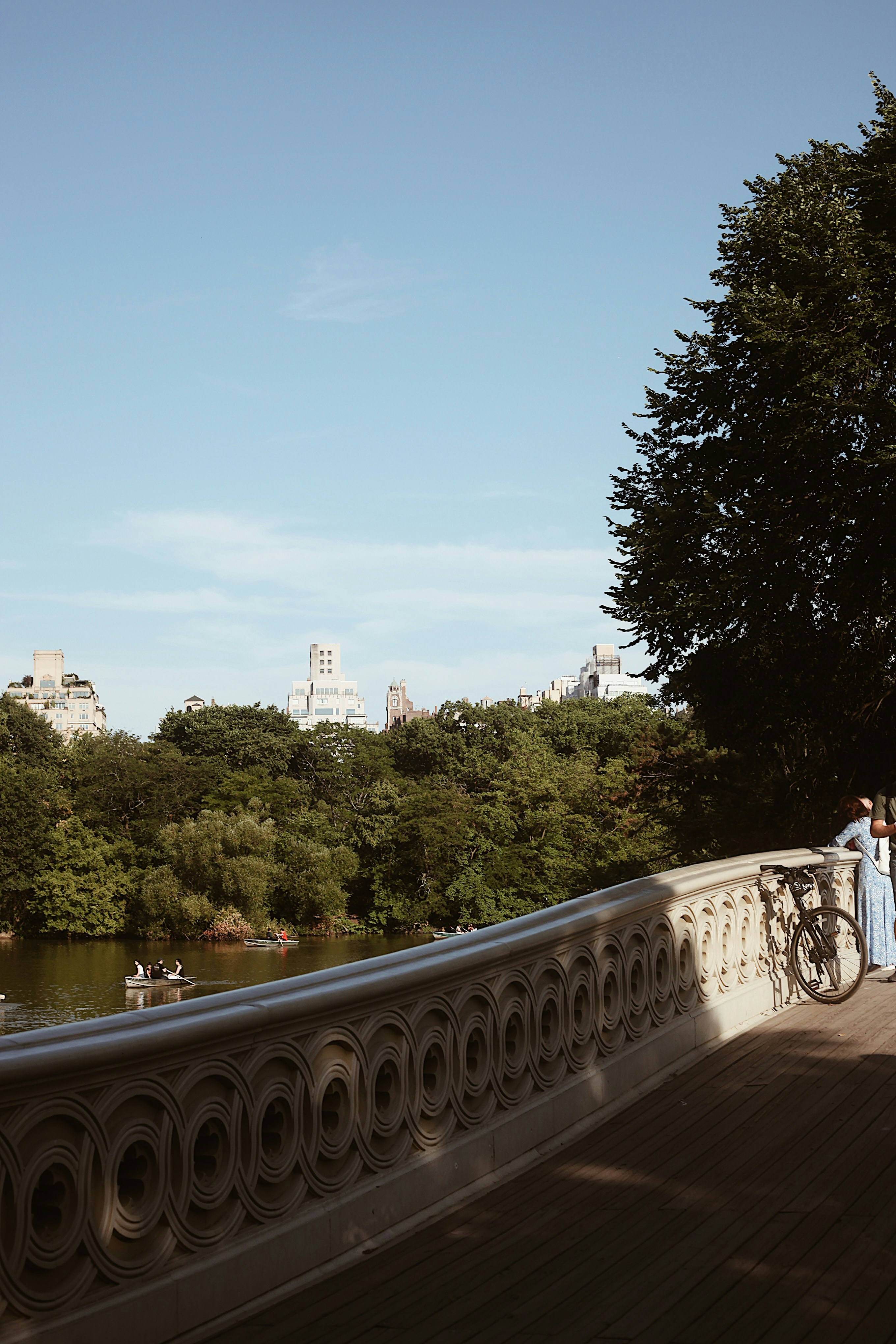 Bridge Rail at Sunset: A Riverside Walk Framing the City