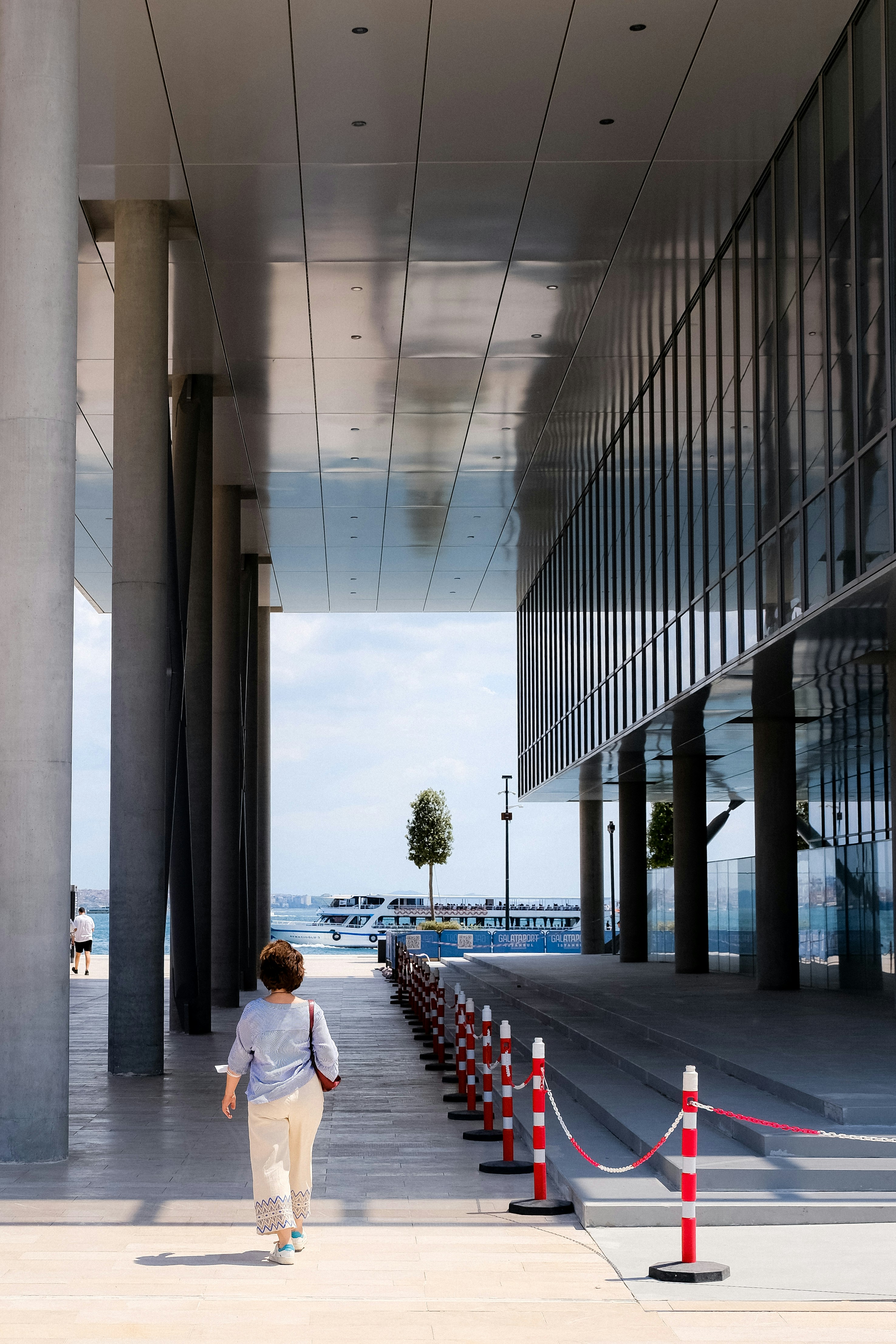 a person walking on a sidewalk