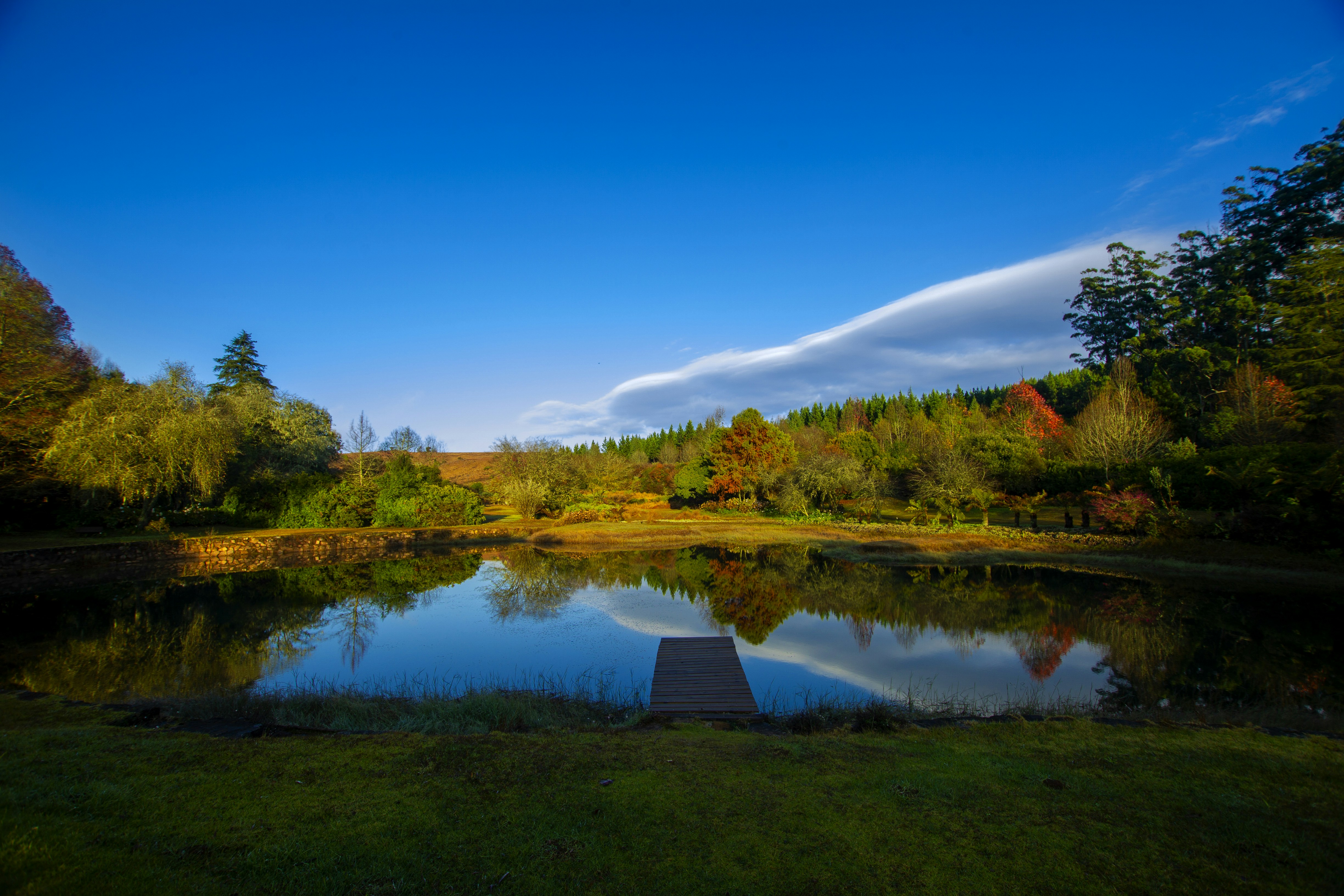 Center Dock, Autumn's Mirror on a Quiet Lake