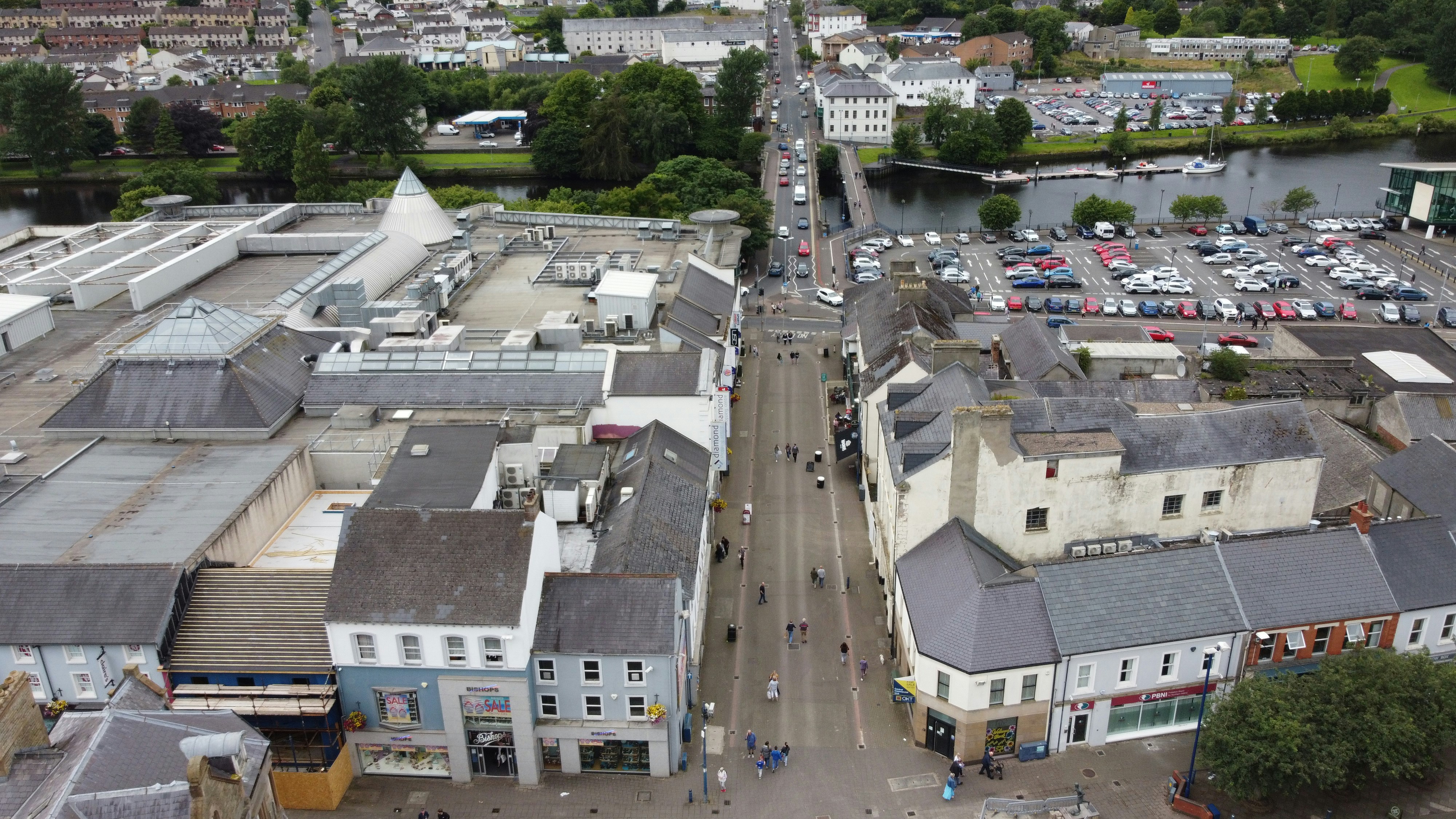 A city with many buildings photo – Free Coleraine town hall Image on ...