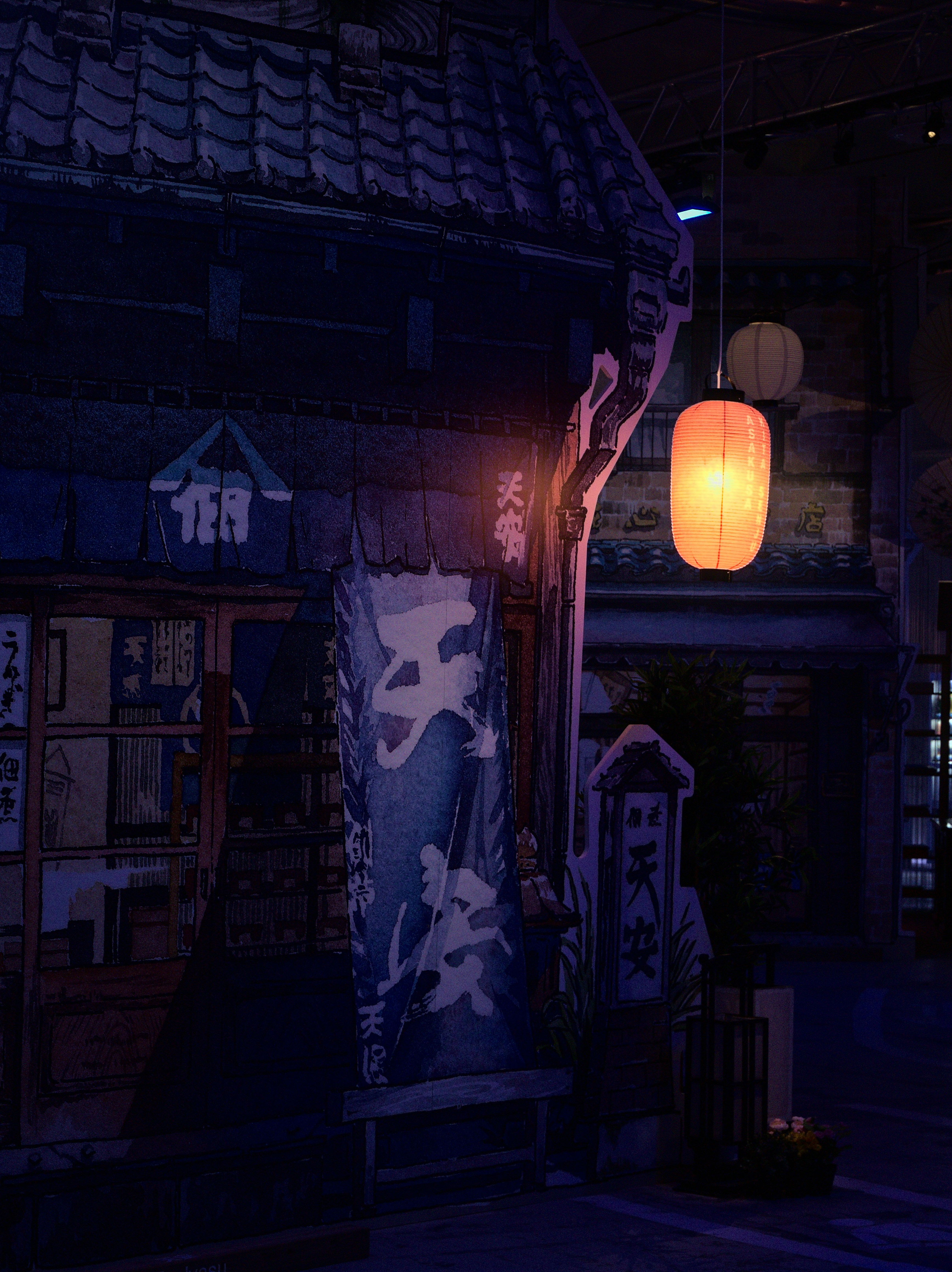 Amber Lantern over a Quiet Blue Night Street in a Traditional Japanese Alley