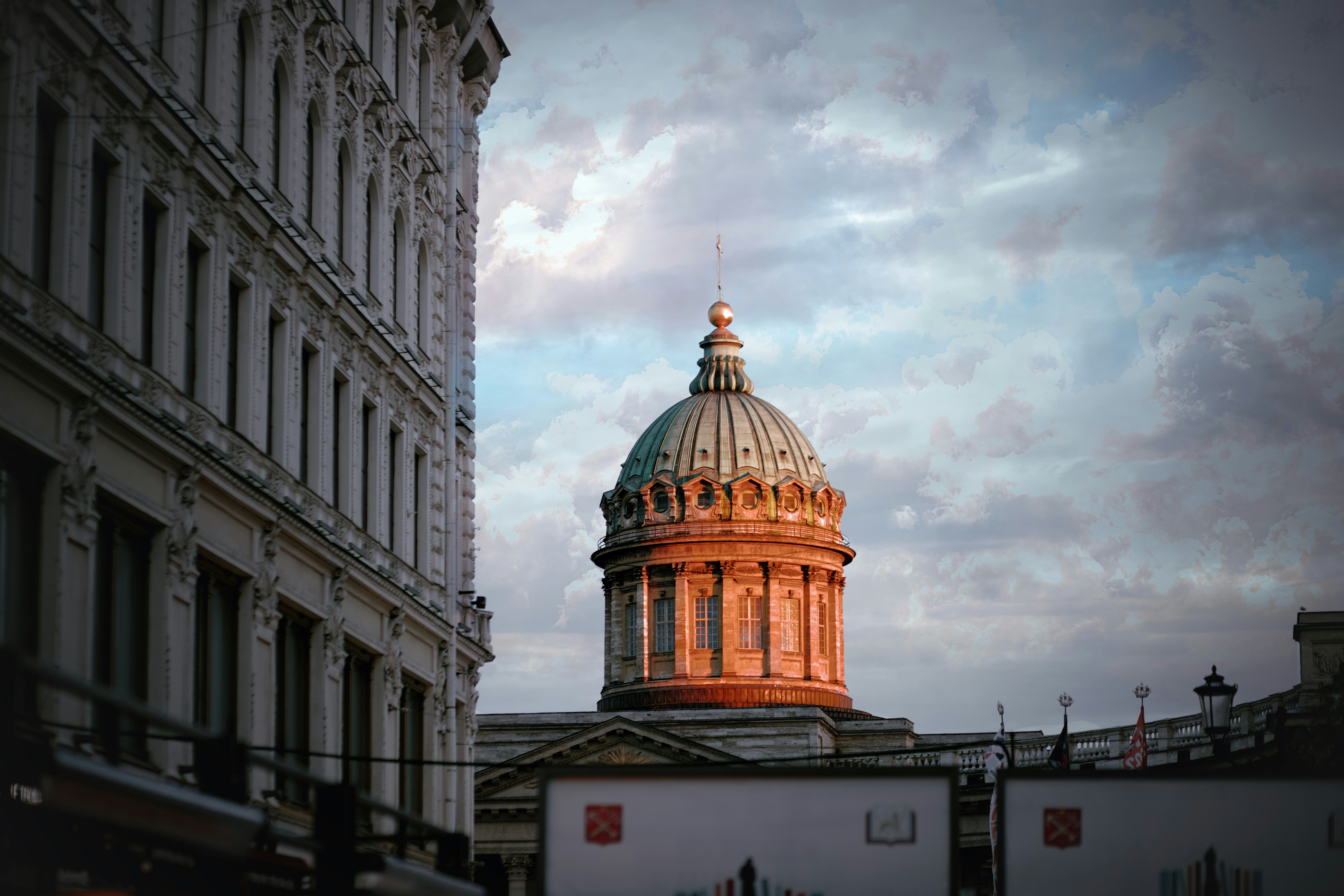 Dome at Golden Hour: Luminescent Cupola Framed by Historic Facades