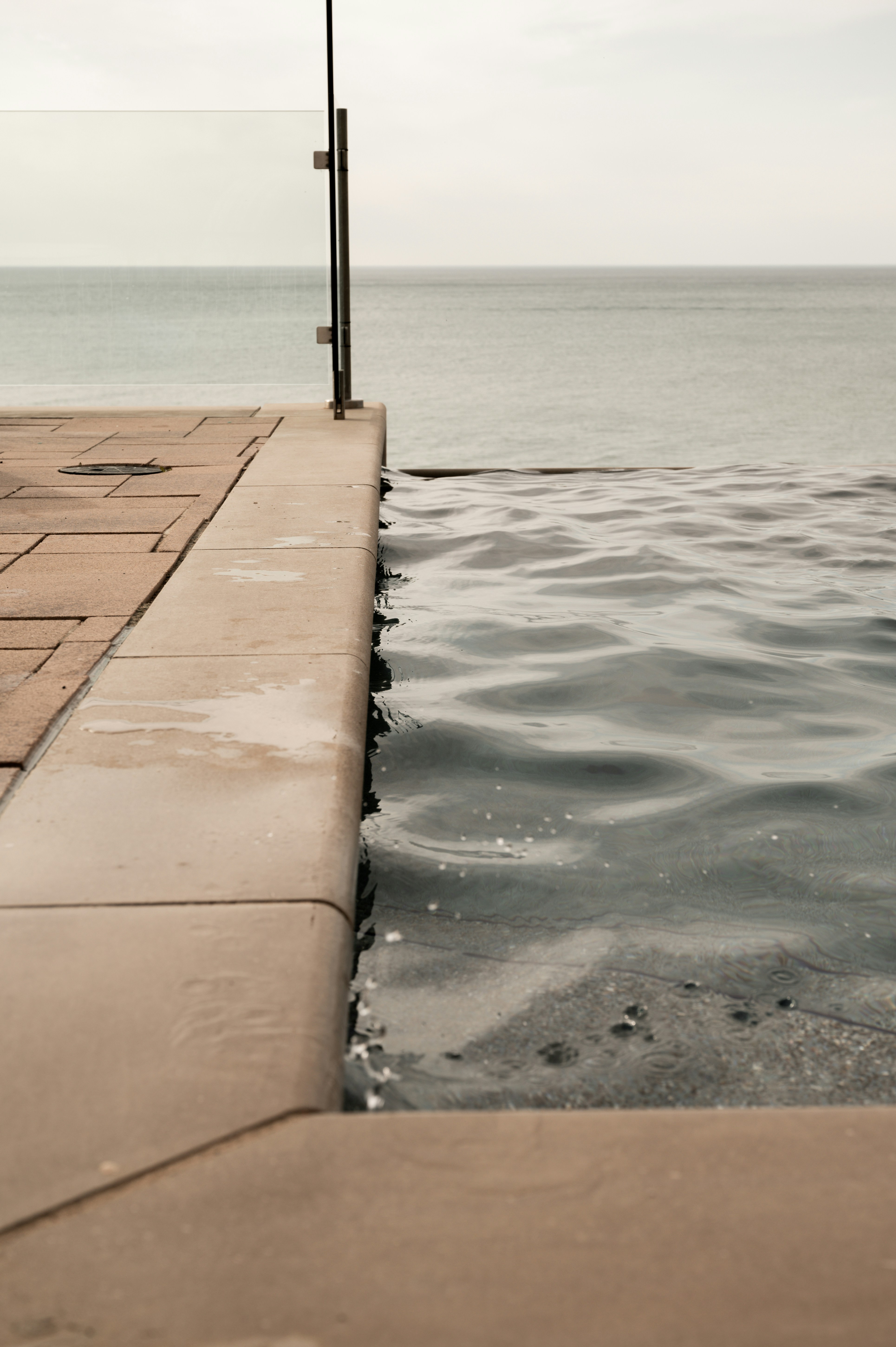 A concrete walkway over water photo – Free Grey Image on Unsplash