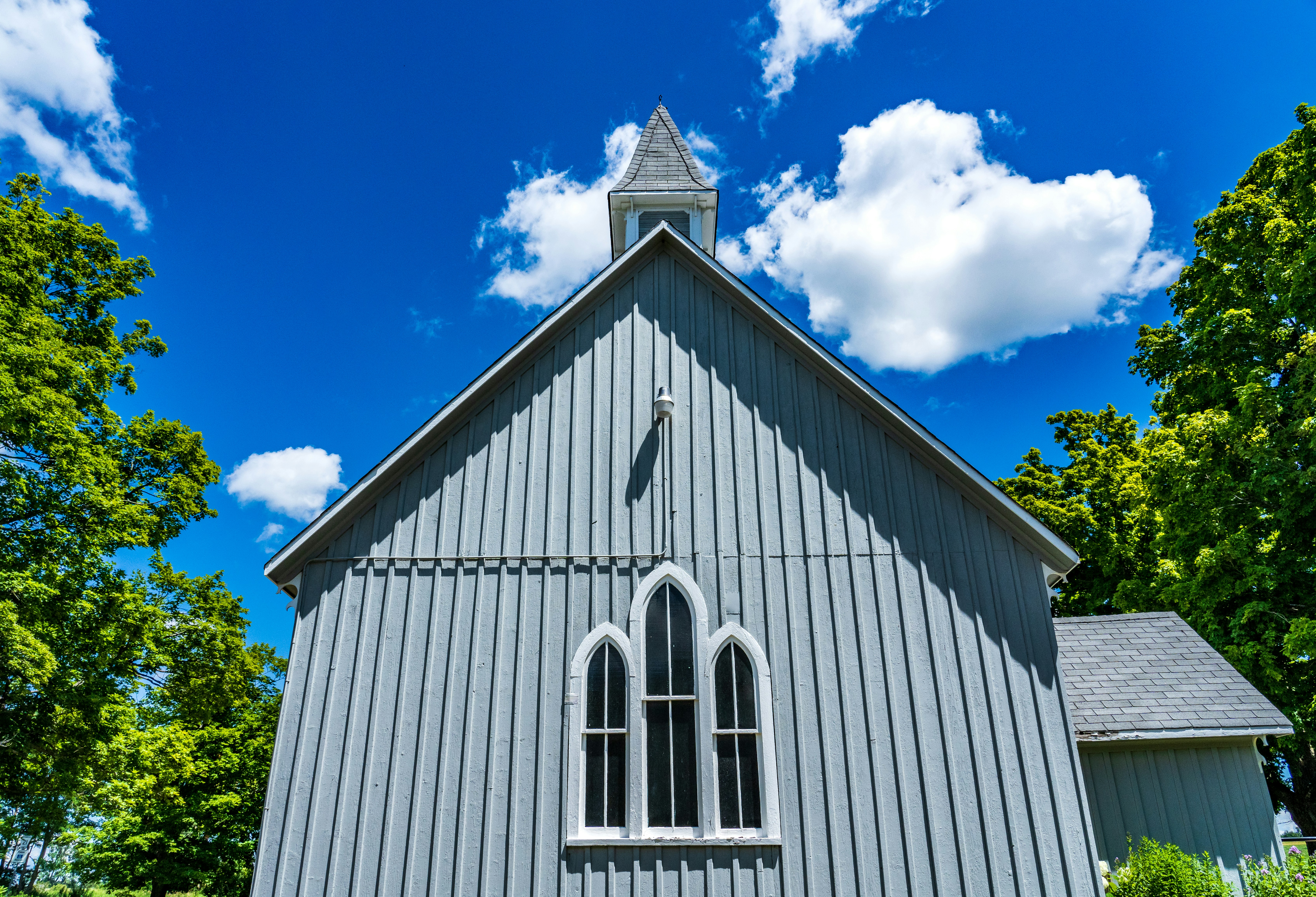 a historic wooden church out in the countryside
