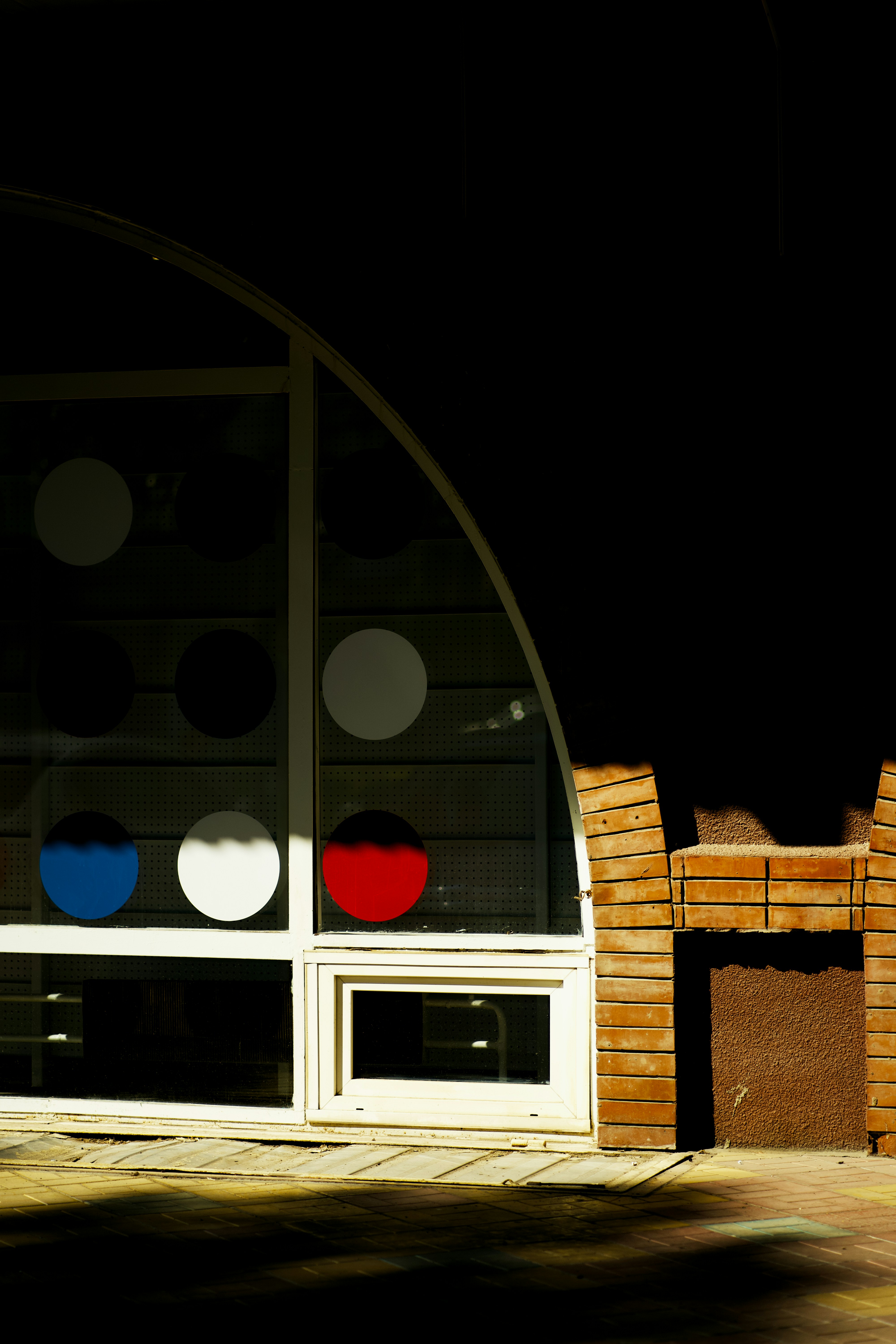 Polychrome Orbs in an Arched Window