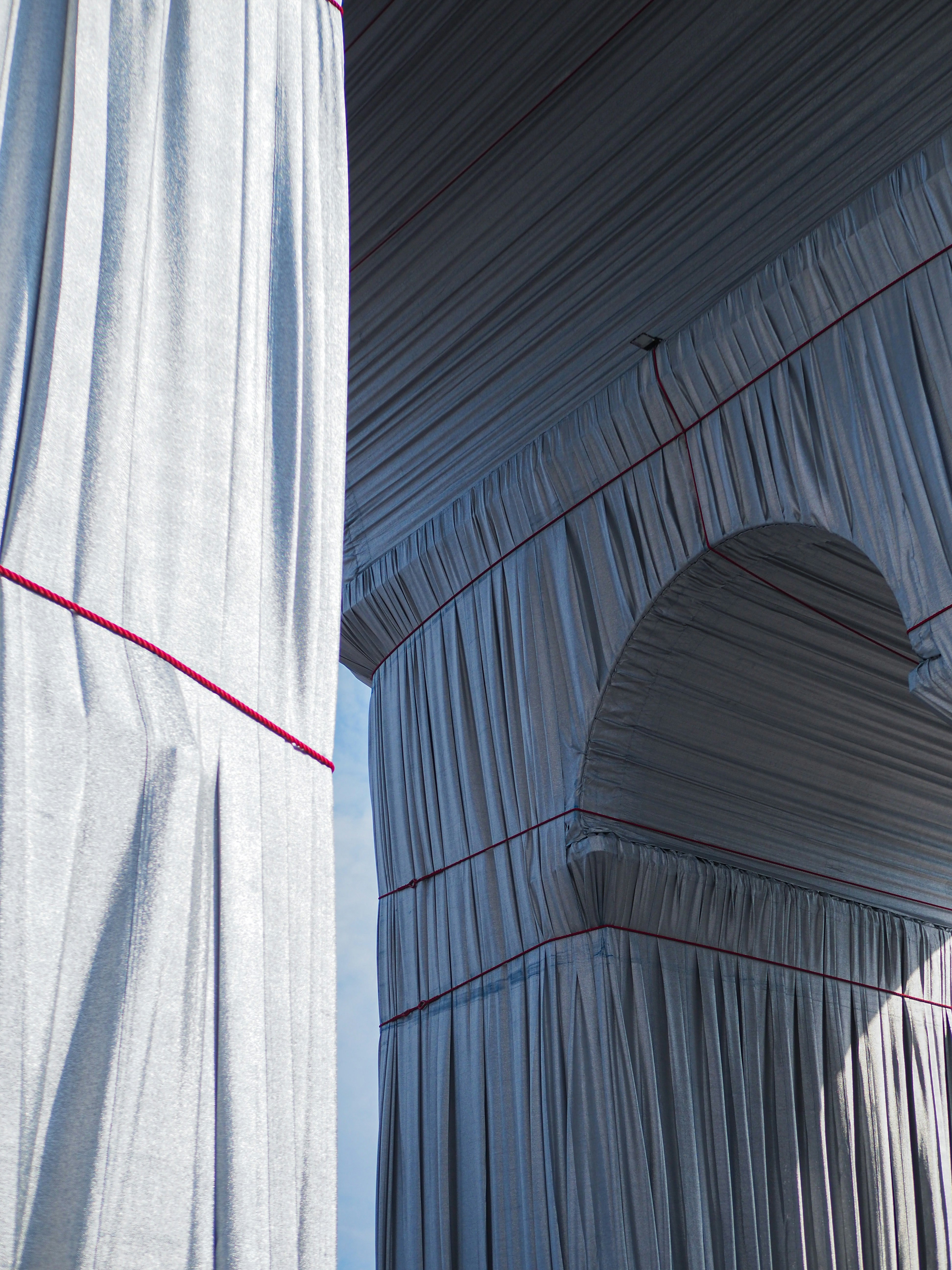 Architectural Drapery: White Canvas Arches and Red Stitch LinesFlorian Peeters