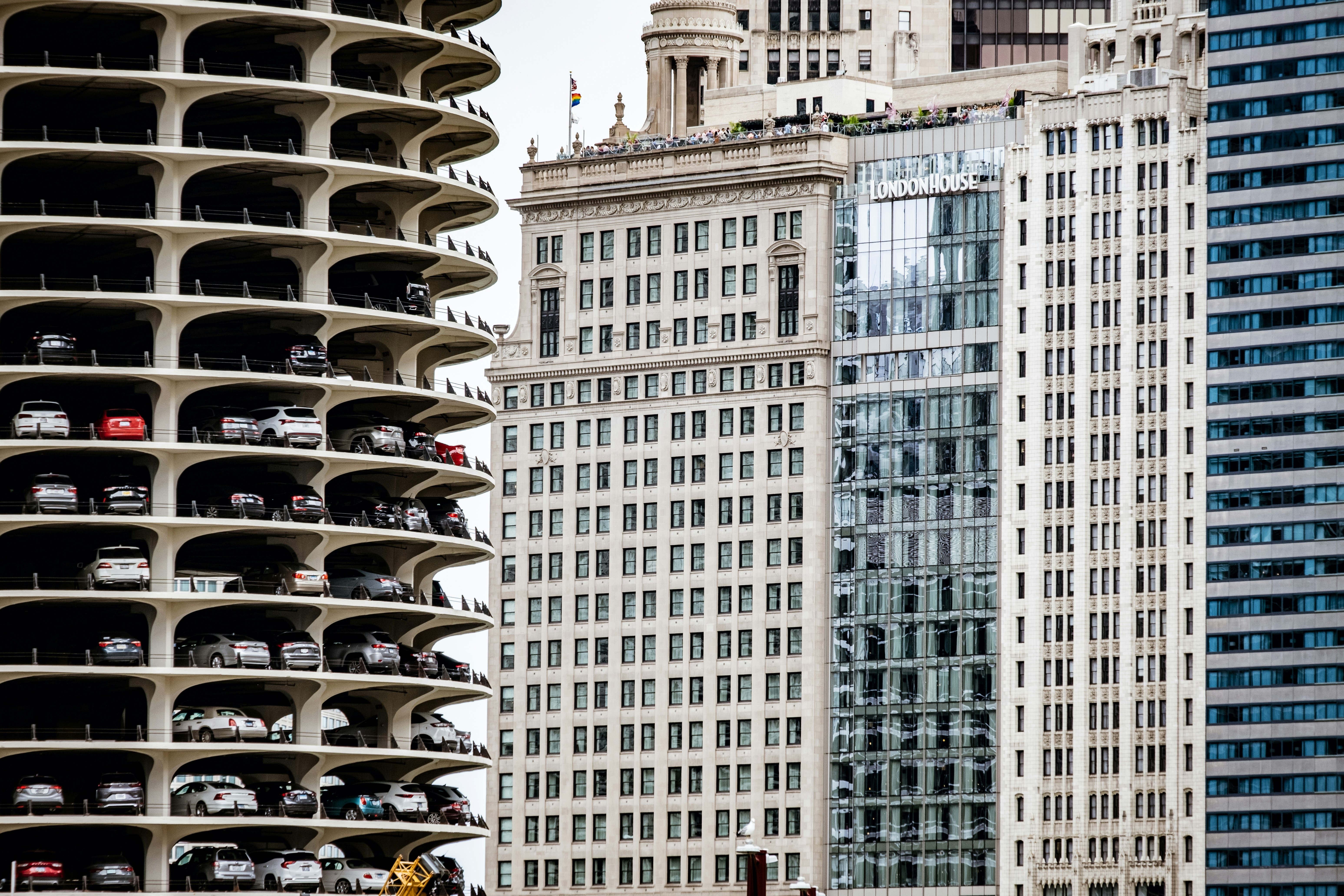 Circles Against Glass: Parking Cylinders Meet Skyscrapers in a Cityscape