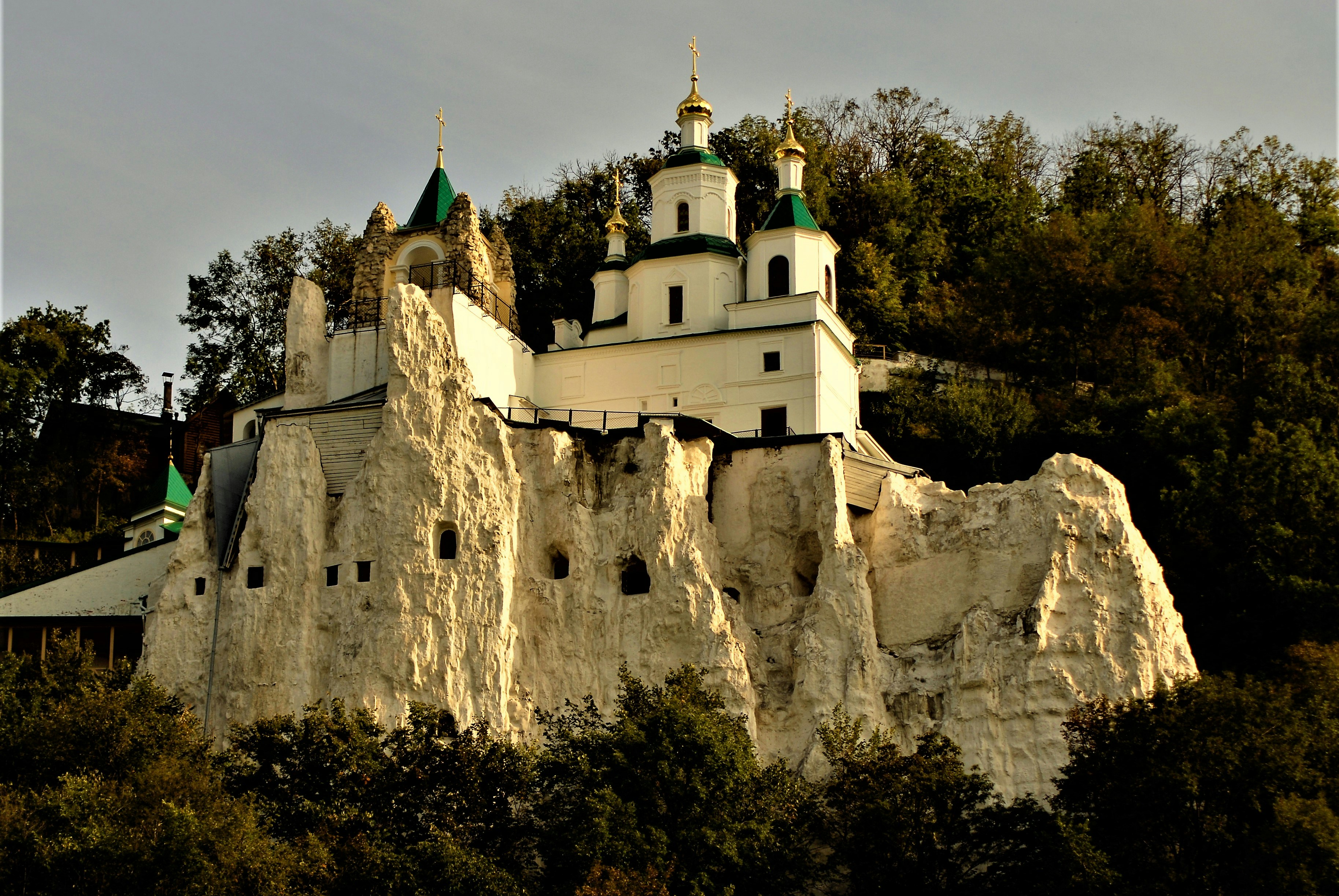 Crowning White Fortress Above the Autumn Woods