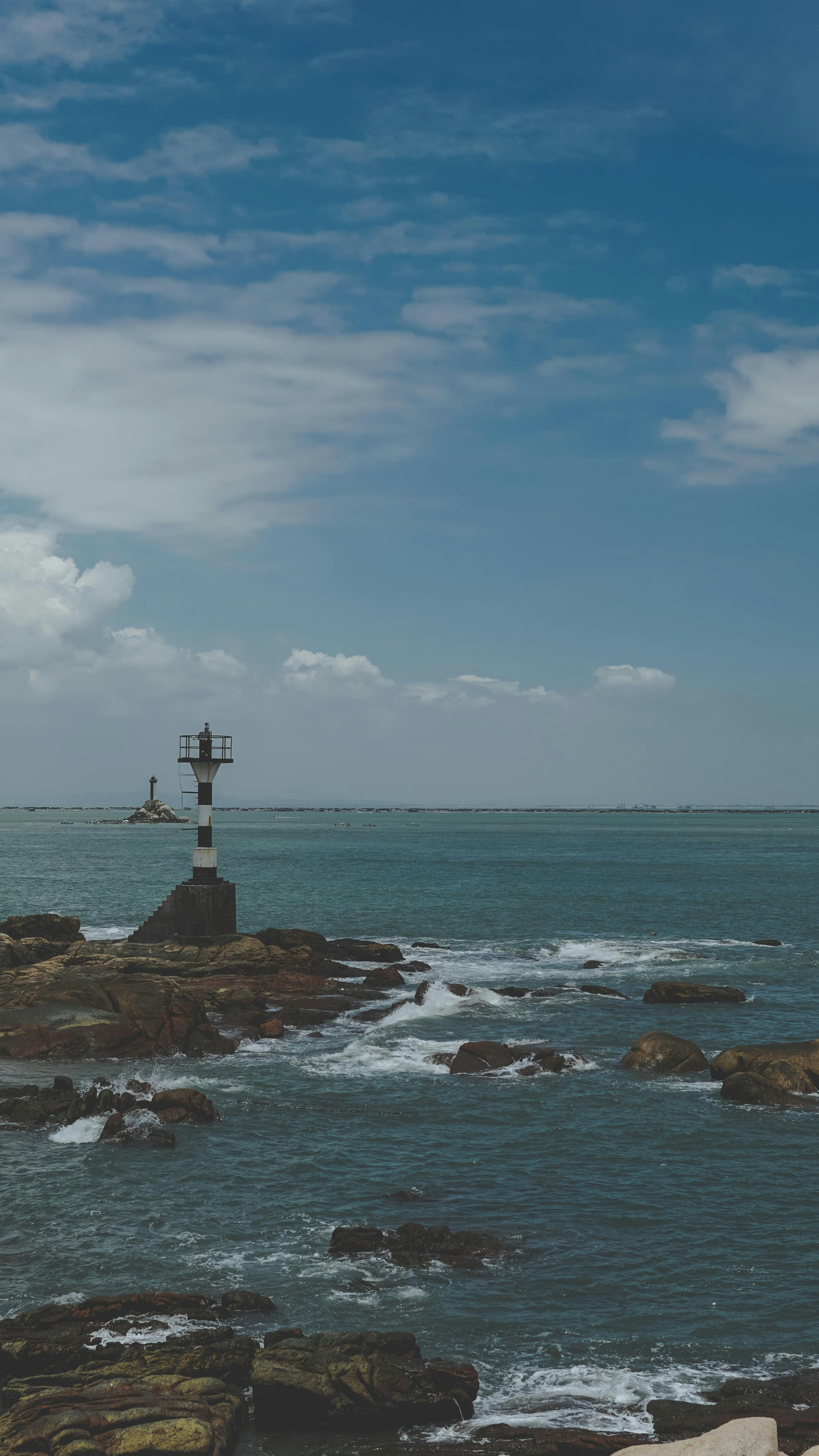 Lighthouse Sentinel at the Edge of Quiet Seas