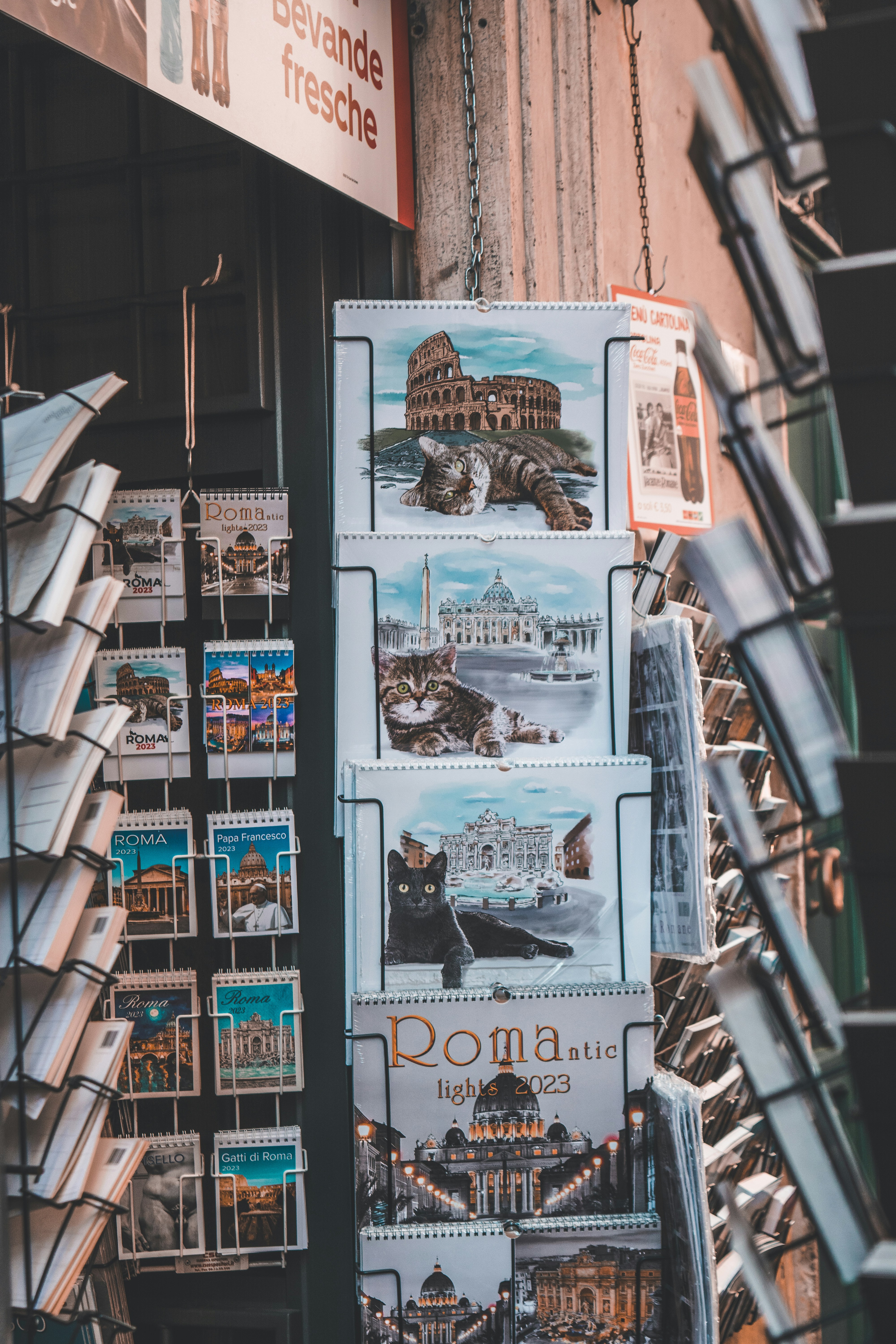 Stacked Rome: Postcards with Cats Framing a Street Corner