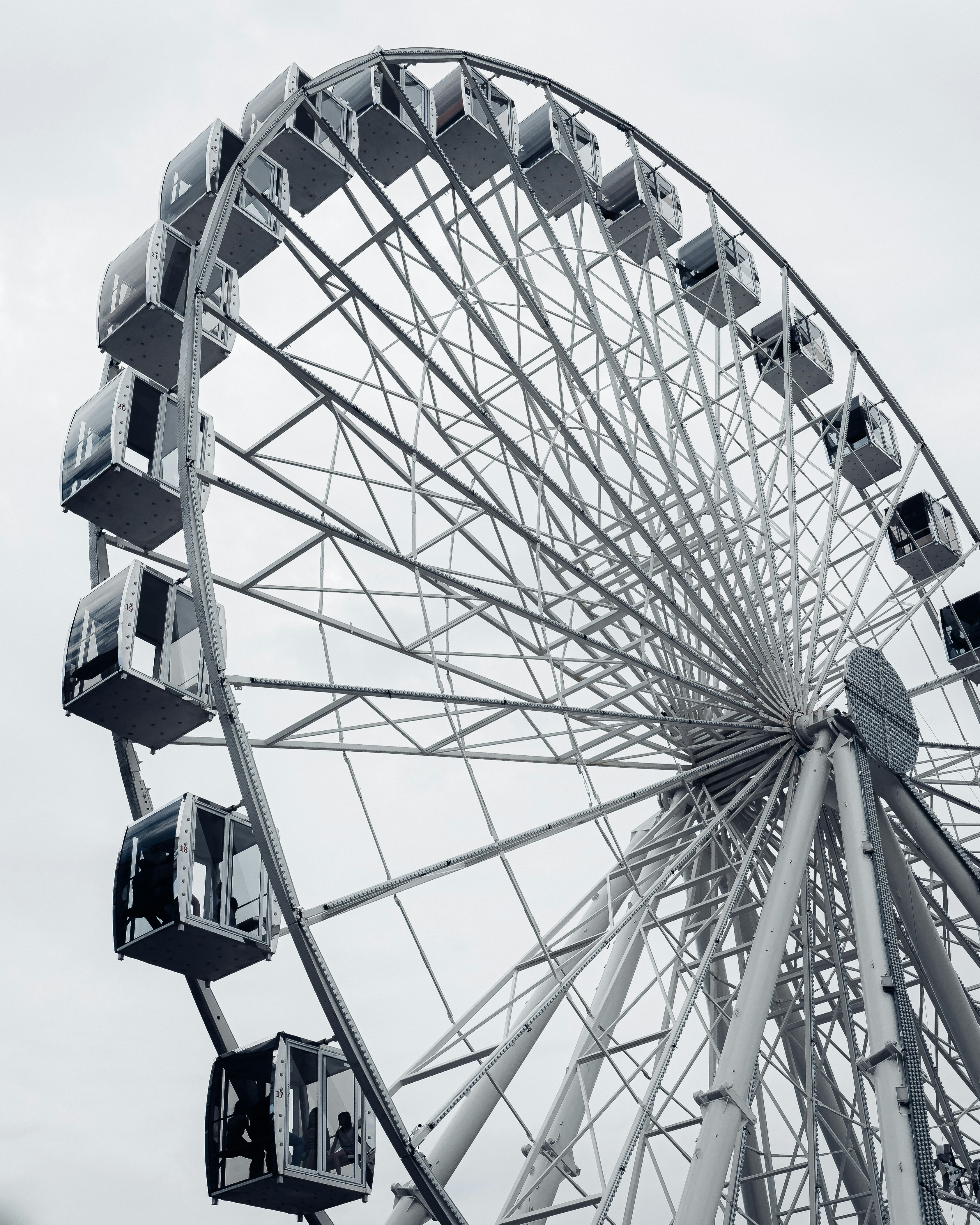a ferris wheel with a cloudy skyMaksym Tymchyk 🇺🇦