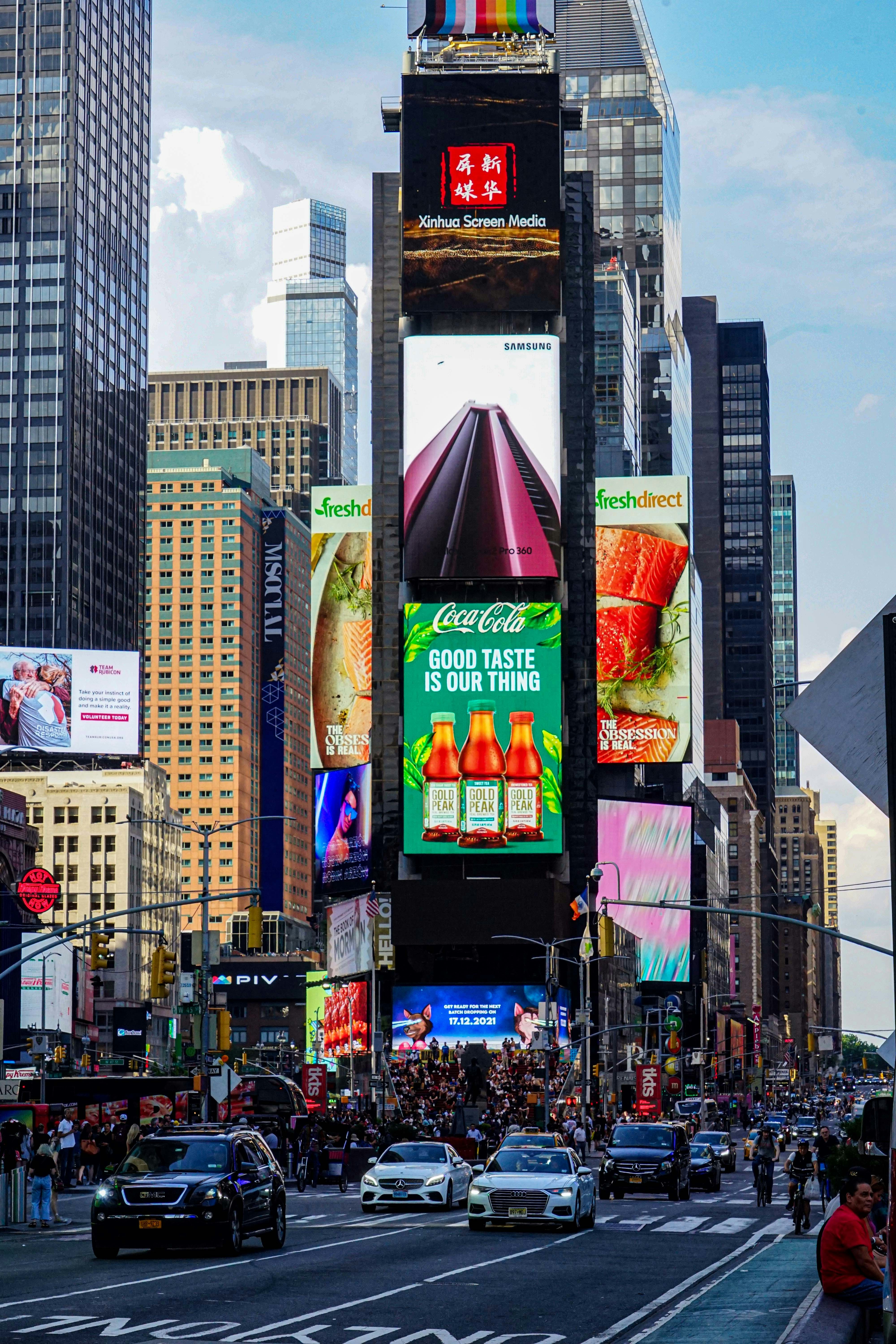 A city street with many billboards photo – Free Times square Image on ...