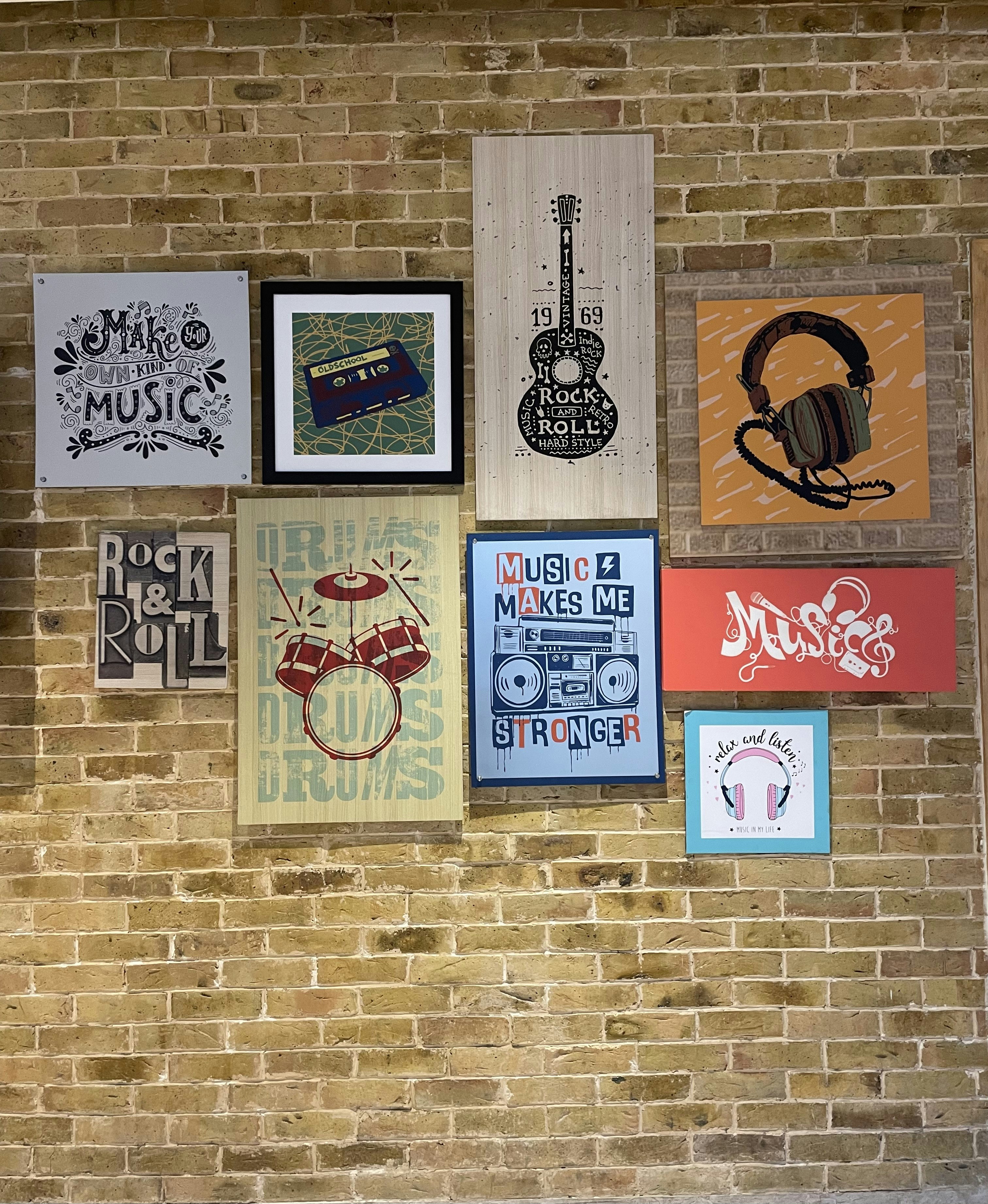 Wall Gallery of Music-Themed Posters in Warm Brick Corridor