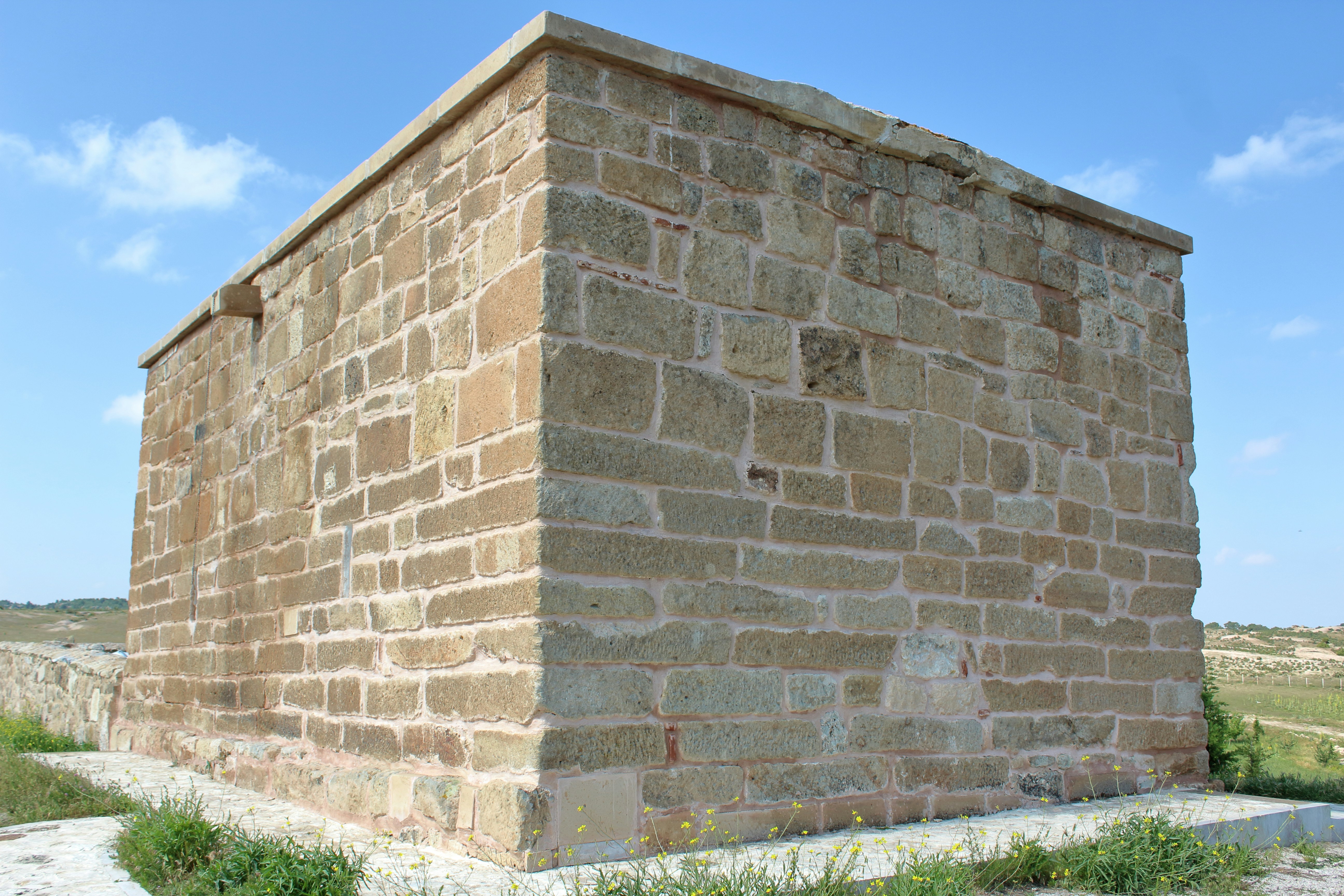 a brick building with a blue sky