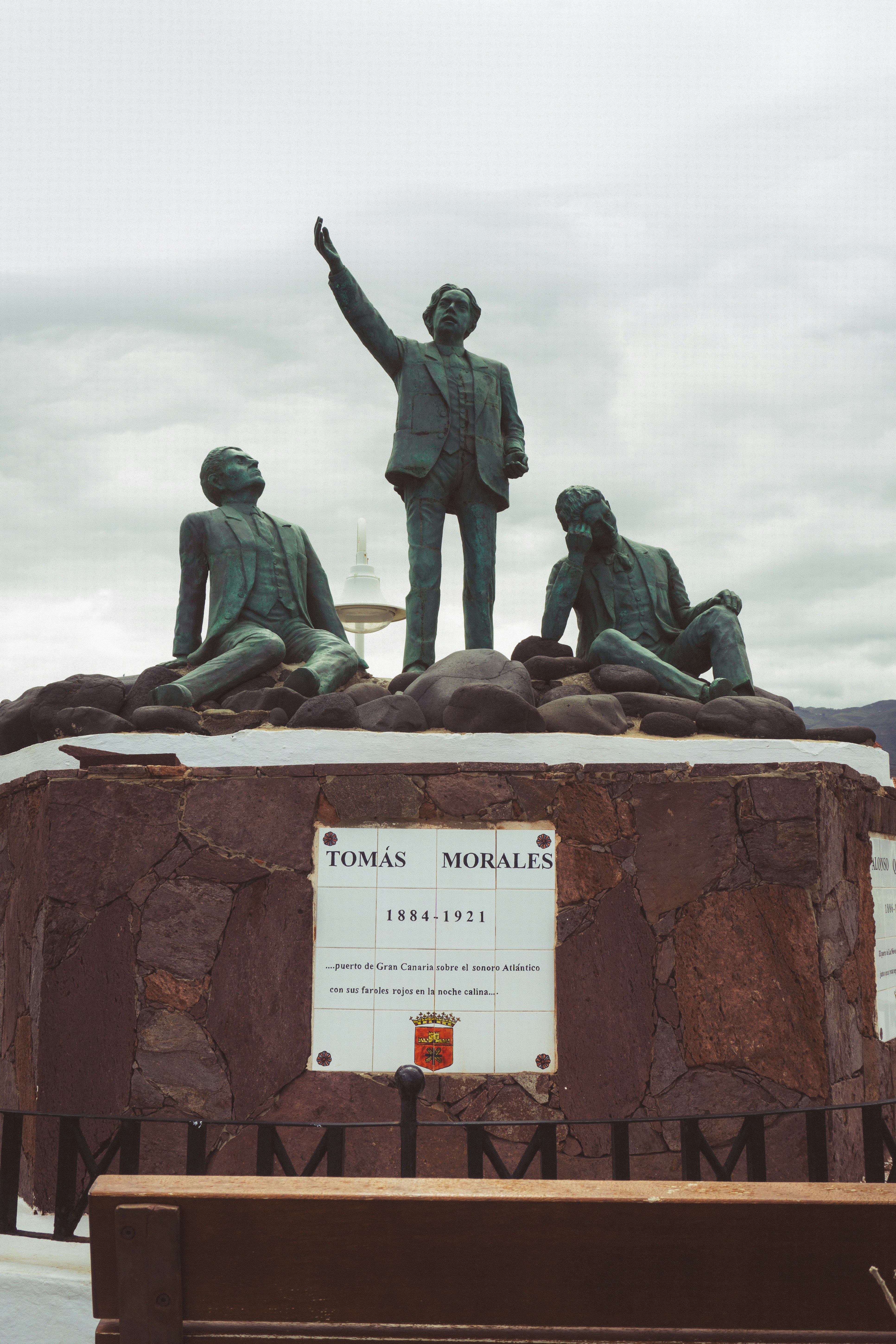 Rising Gesture over Stone: The Tomás Morales Monument in a Cloudy Vista