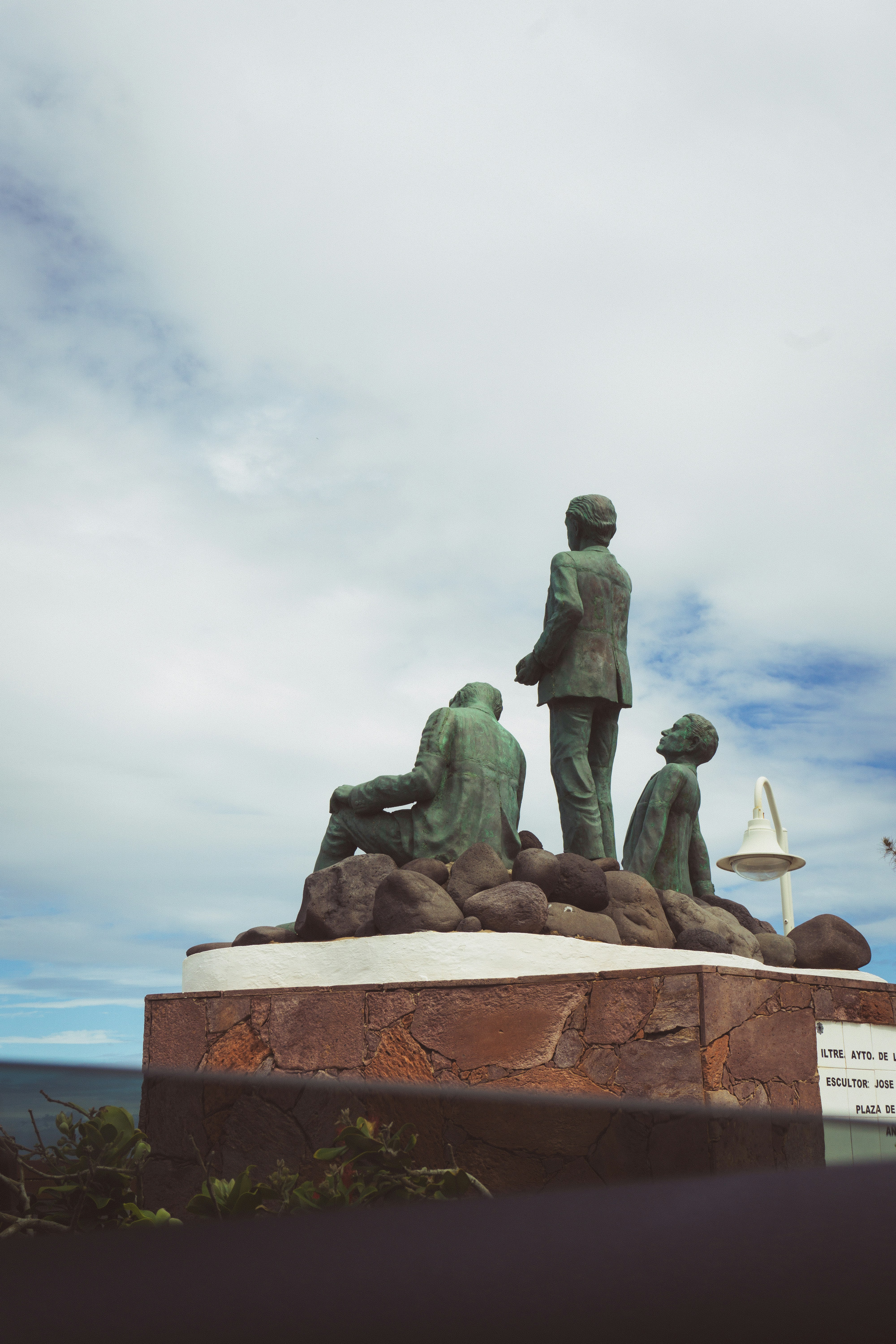 Guardians by the Sea: Bronze Figures Standing Watch Over the Horizon