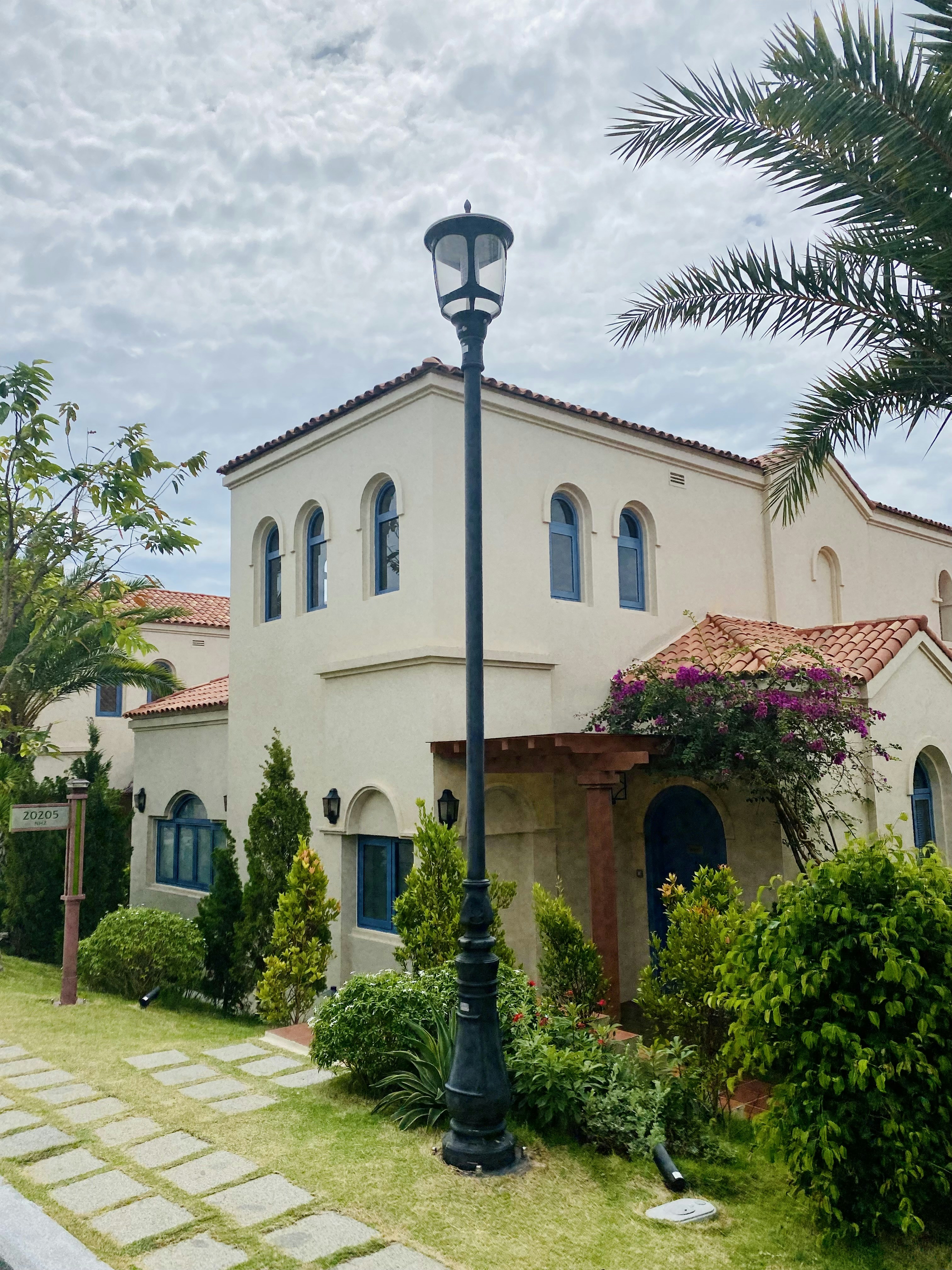 Lamp Post Reverie: Sunlit Mediterranean Courtyard