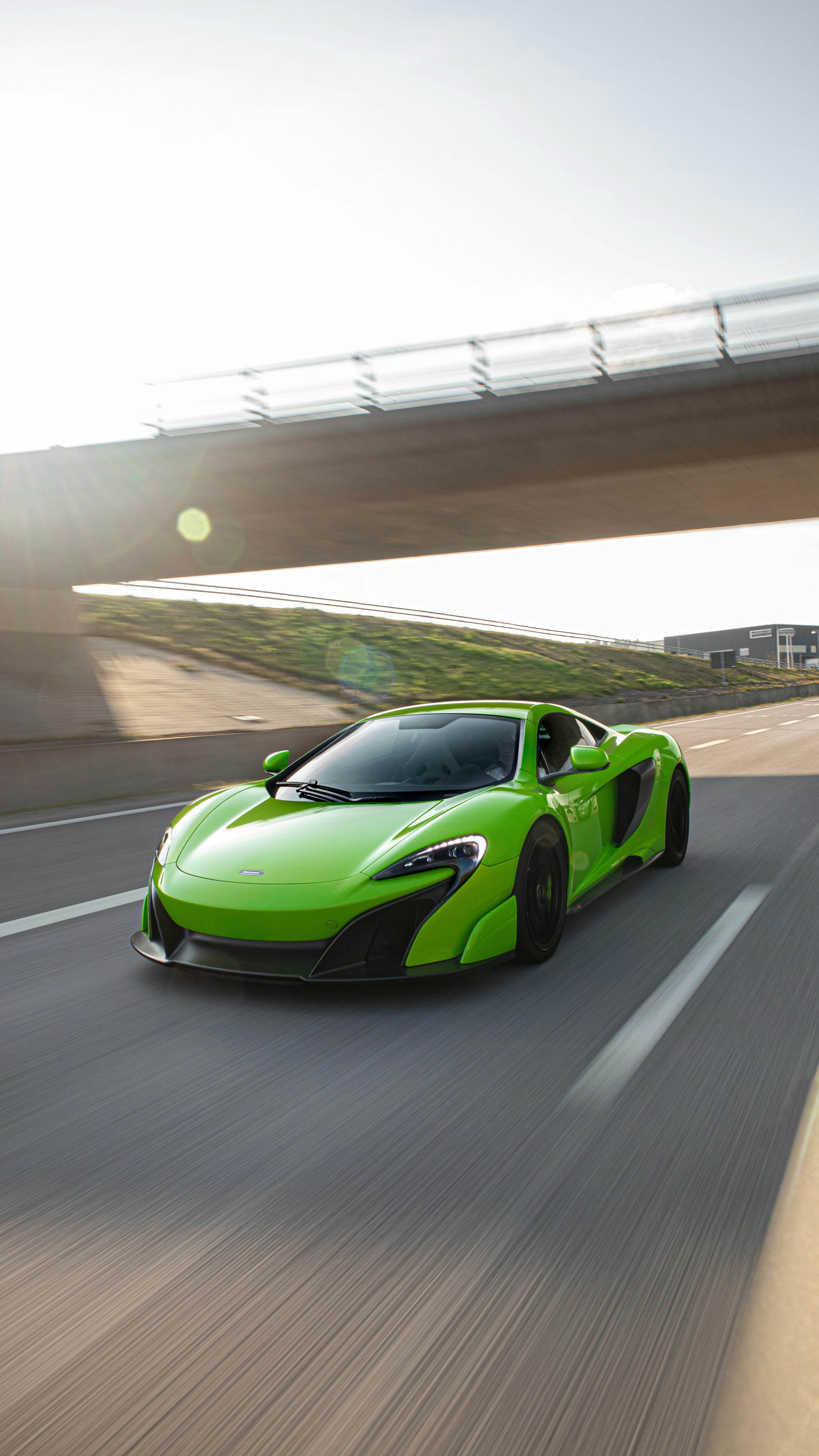 A green sports car on a road photo – Free Goteborg Image on Unsplash