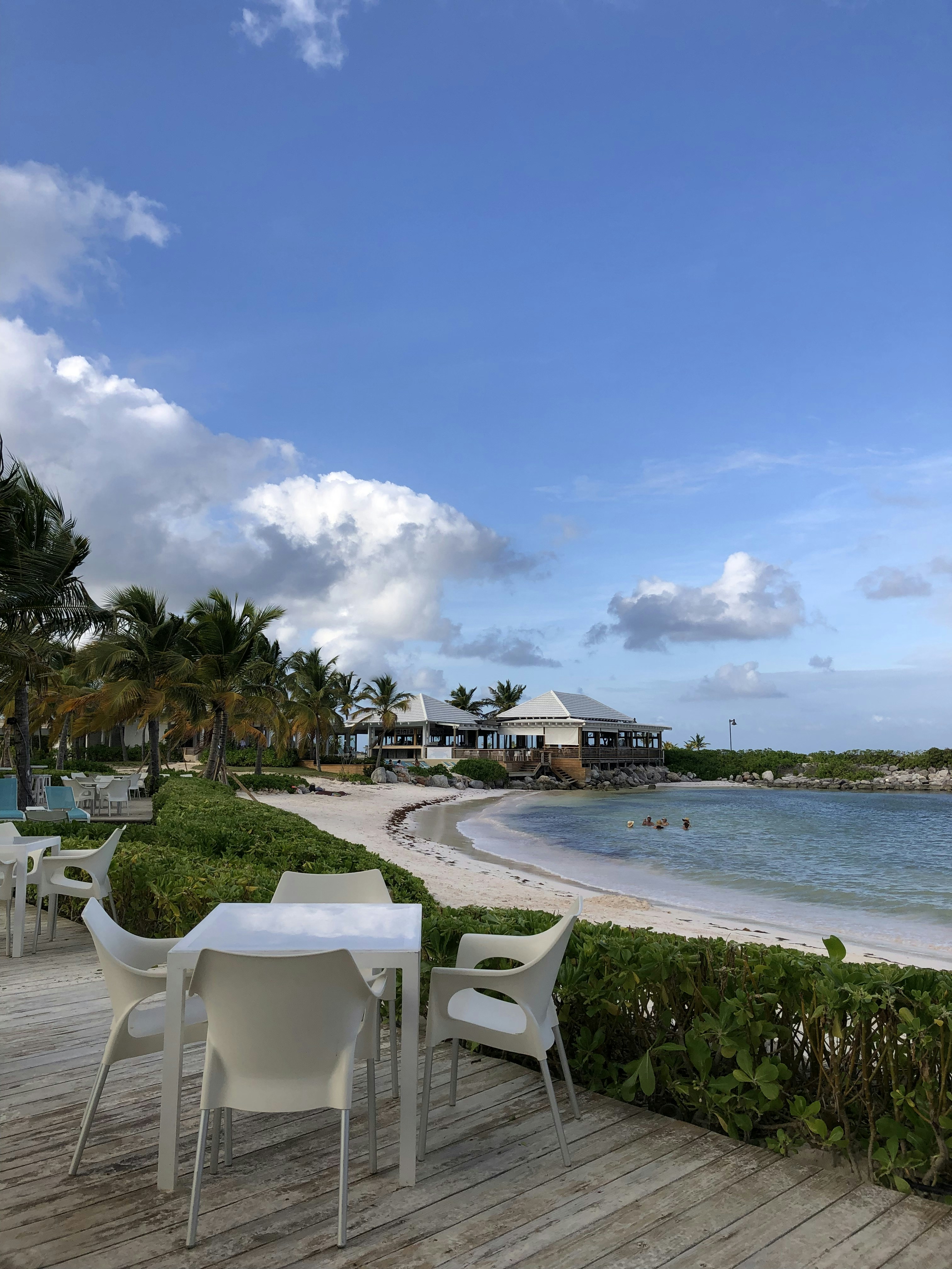 A beach with tables and chairs photo – Free Dominican republic Image on ...