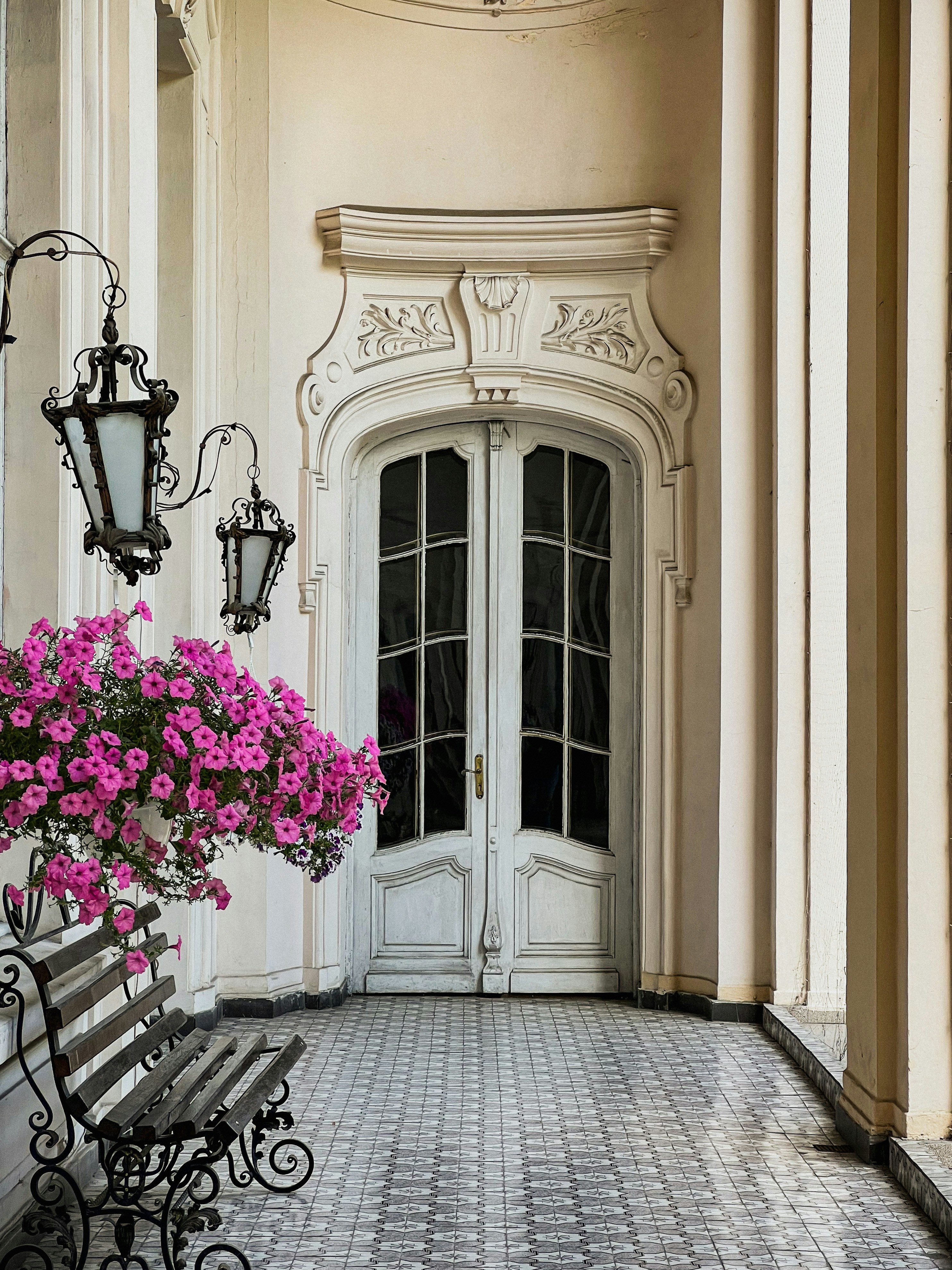 The Gentle Entrance: An Archway Framed by Pink Blooms