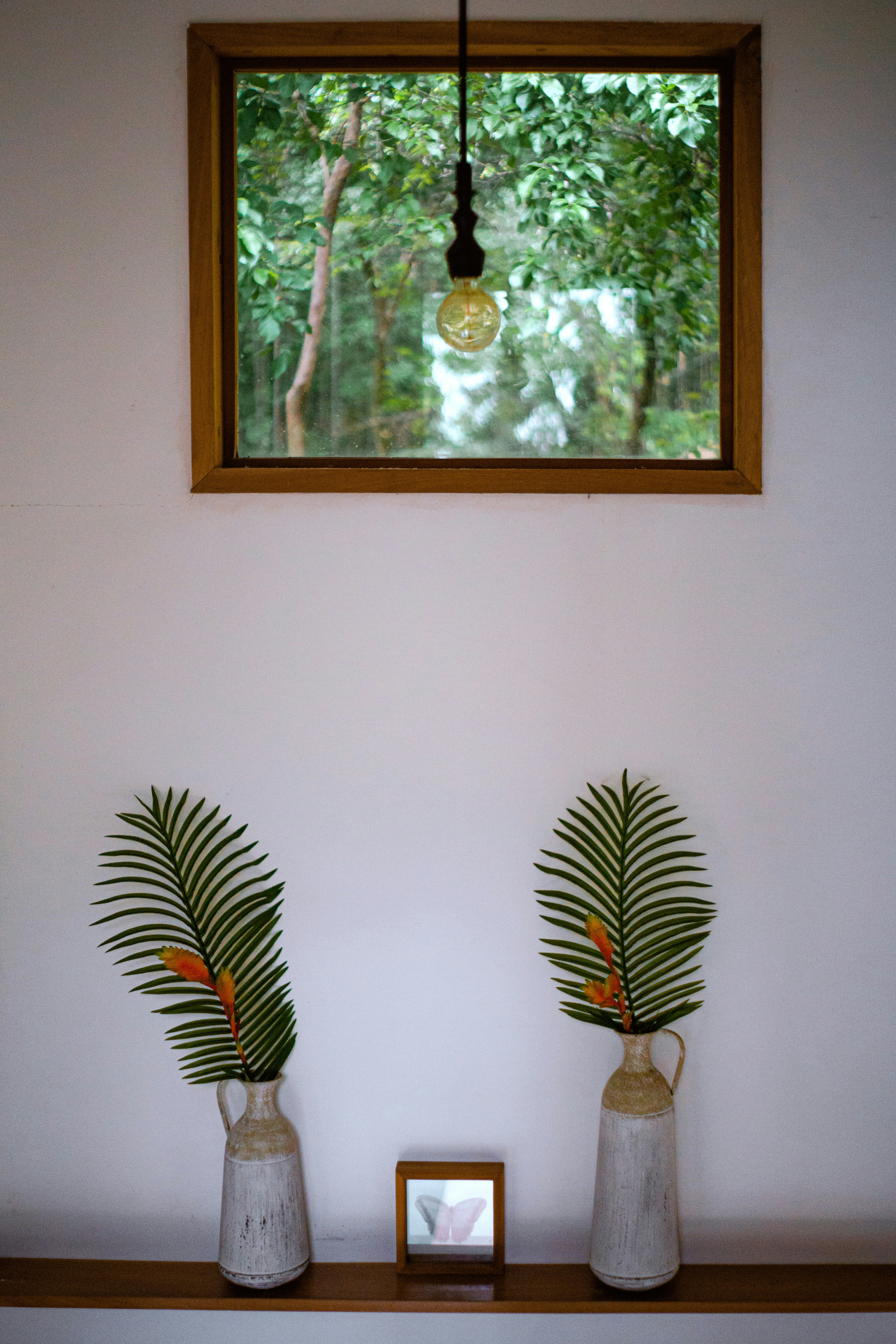 a couple of vases hold flowers
