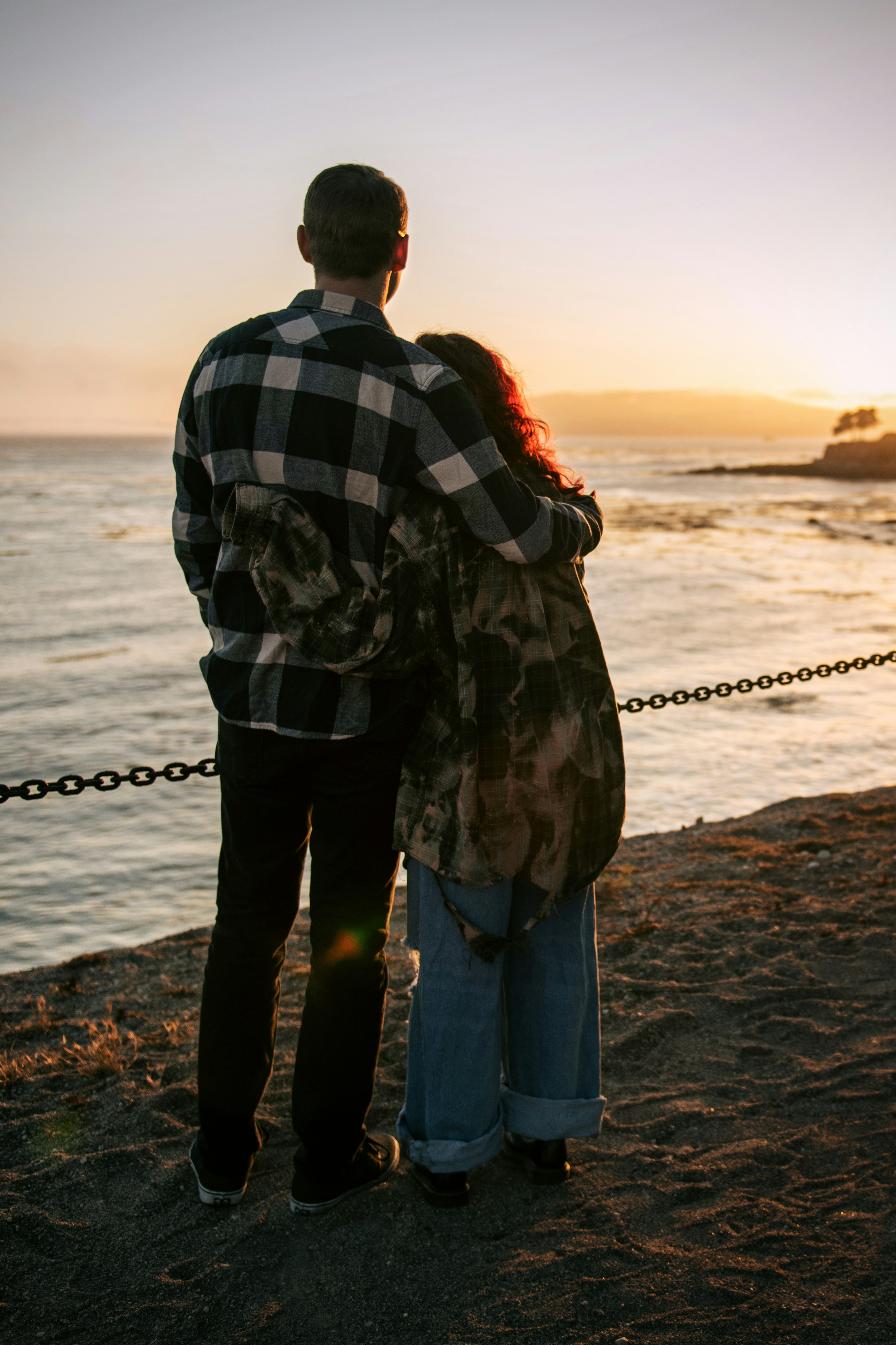 Together at Sunset: A Quiet Moment by the Shore