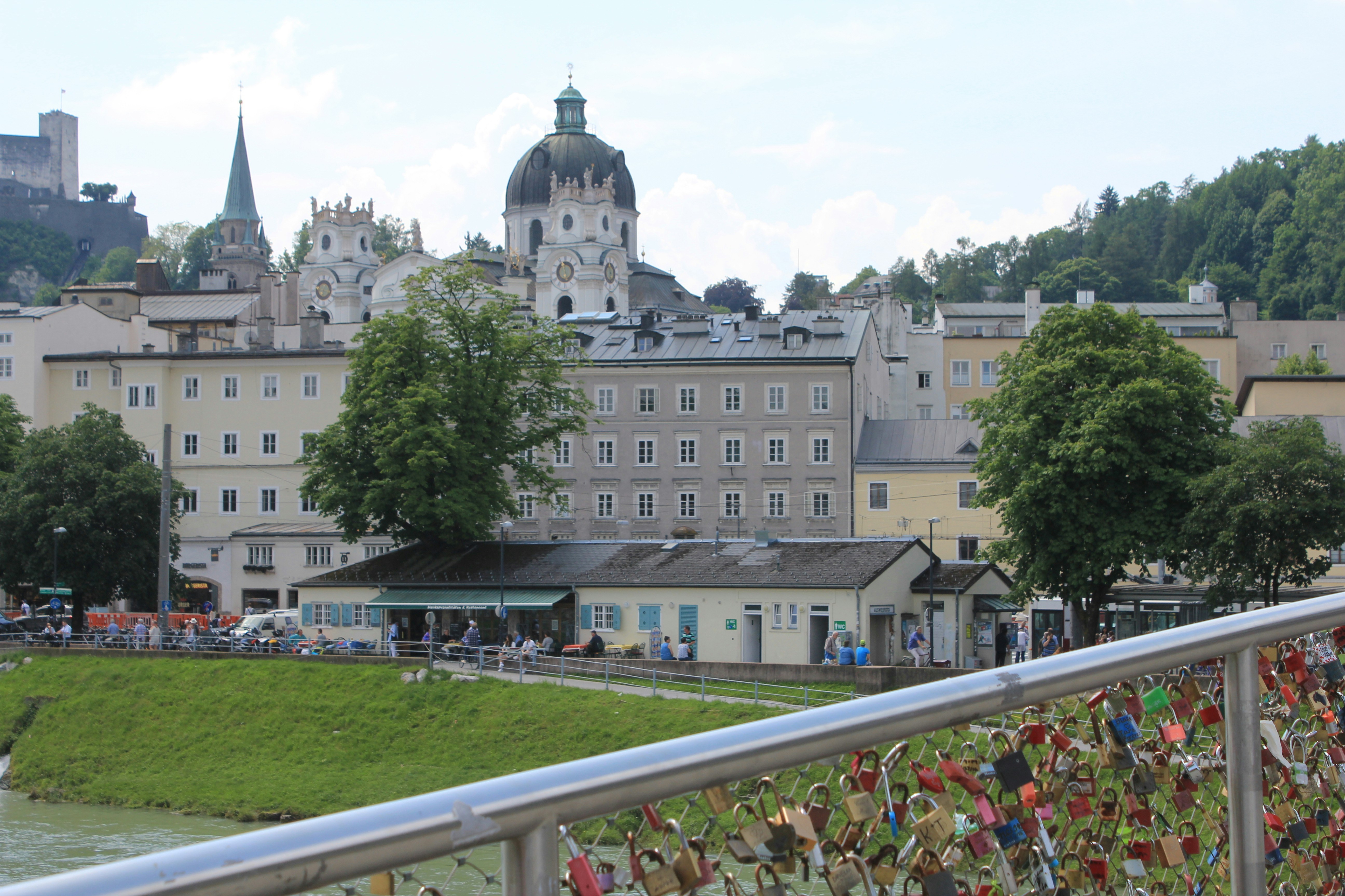 Domed Baroque Crown Over Riverside Cityscape with Love-Lock Railing