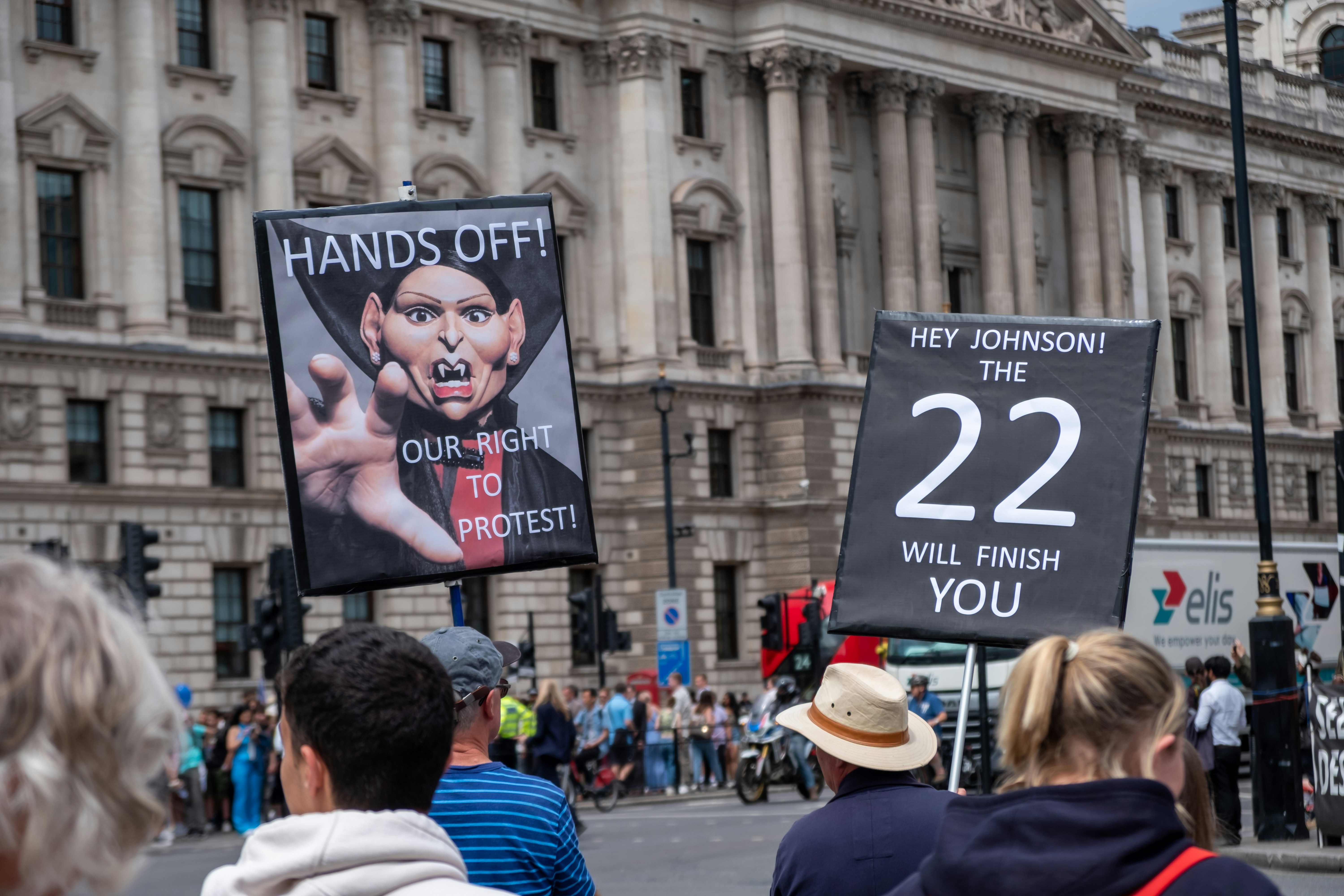 A large crowd of people outside a building photo – Free Westminster ...