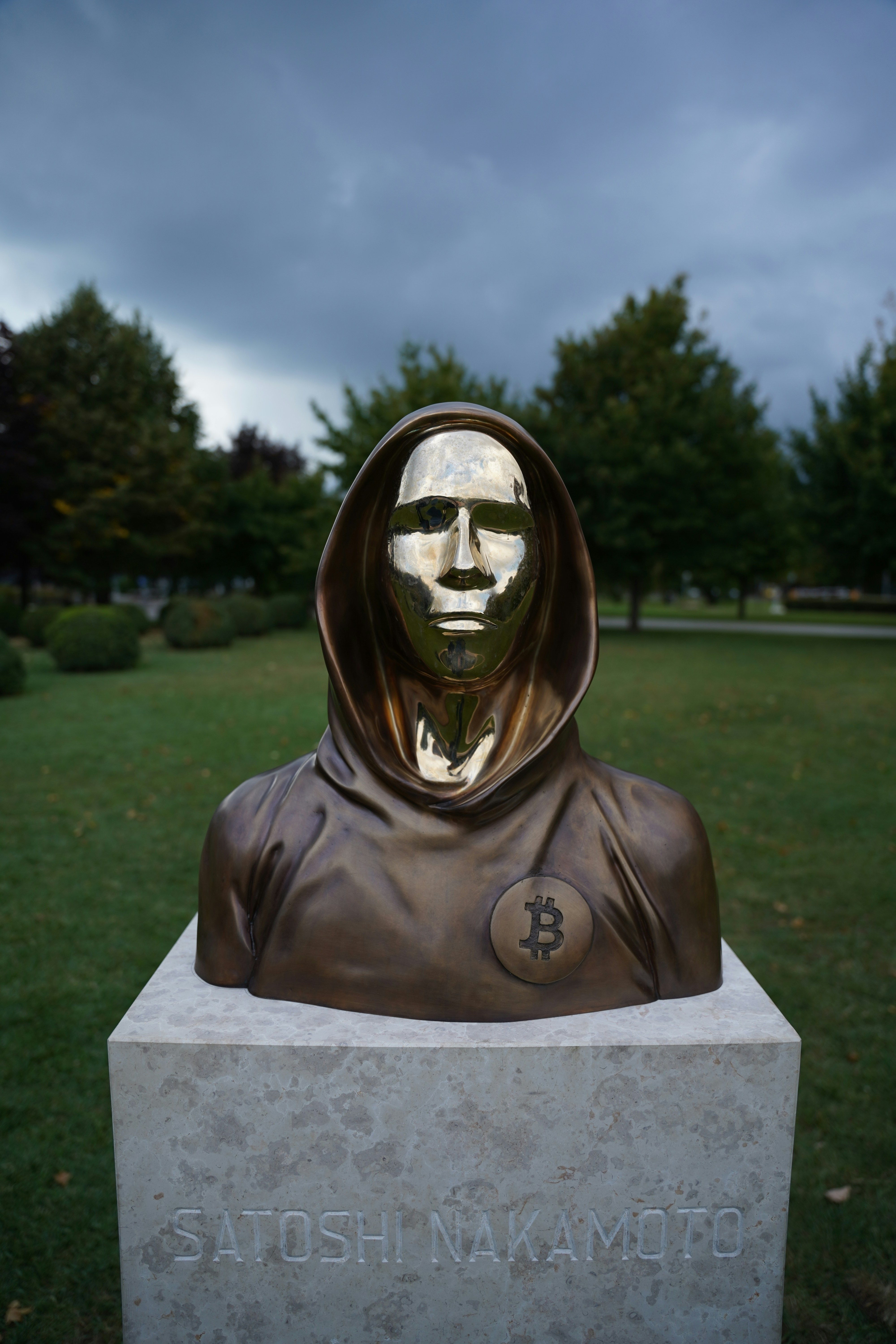 Reflective Hood in the Park: The Satoshi Nakamoto Monument