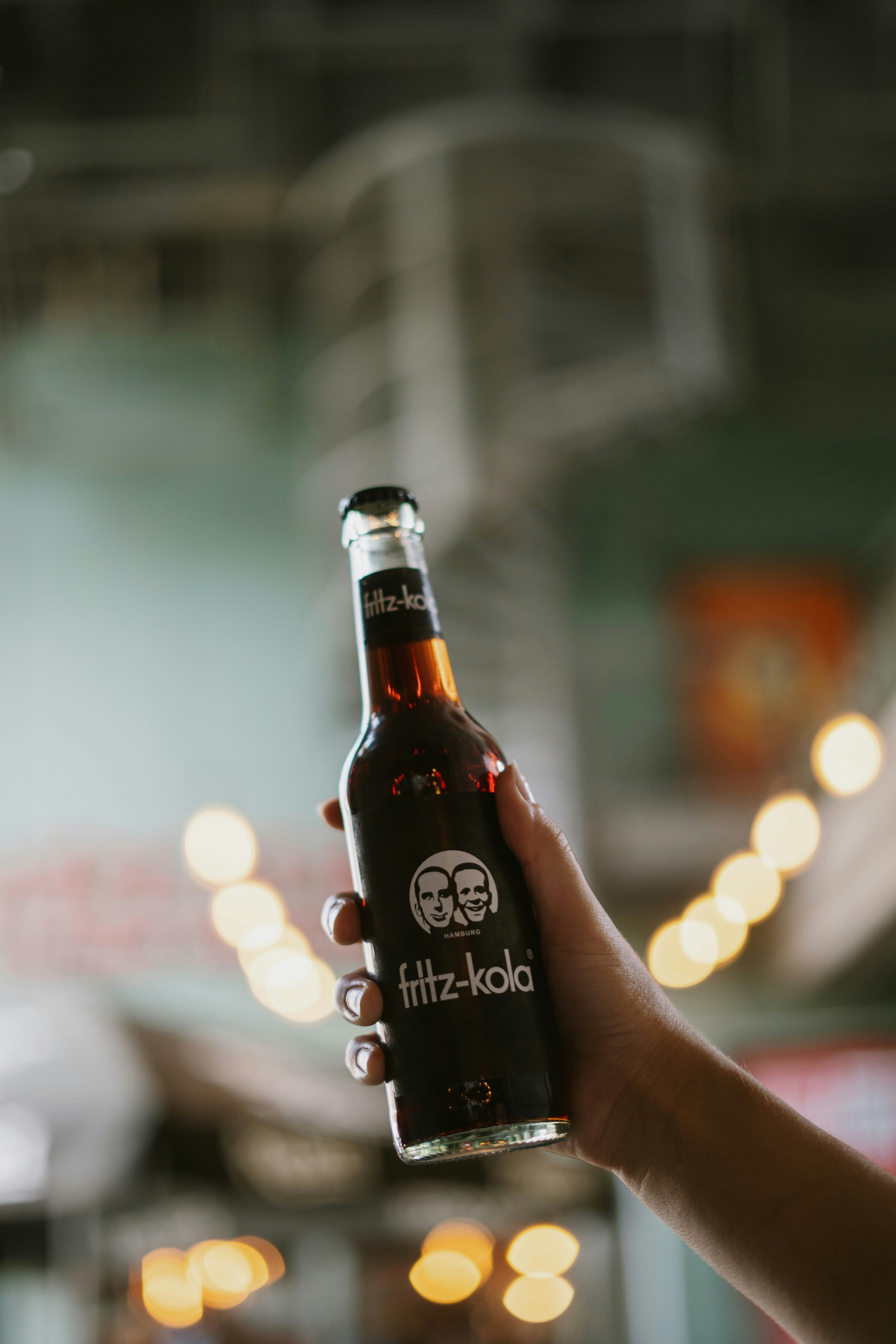 Hand-Grabbed Brew: A Bottled Moment in Soft Focus Neon