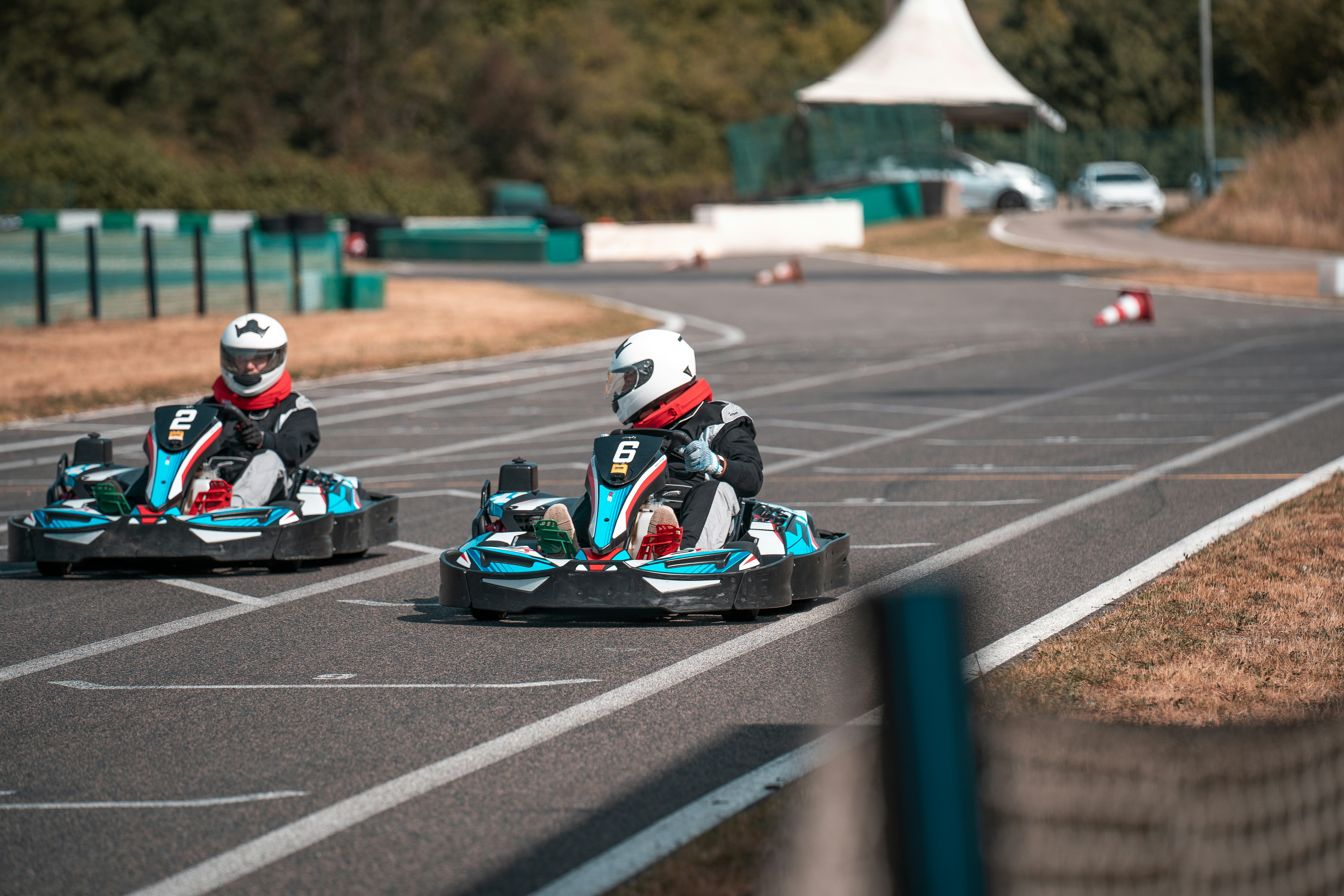 A group of people racing go carts photo – Free Kart Image on Unsplash