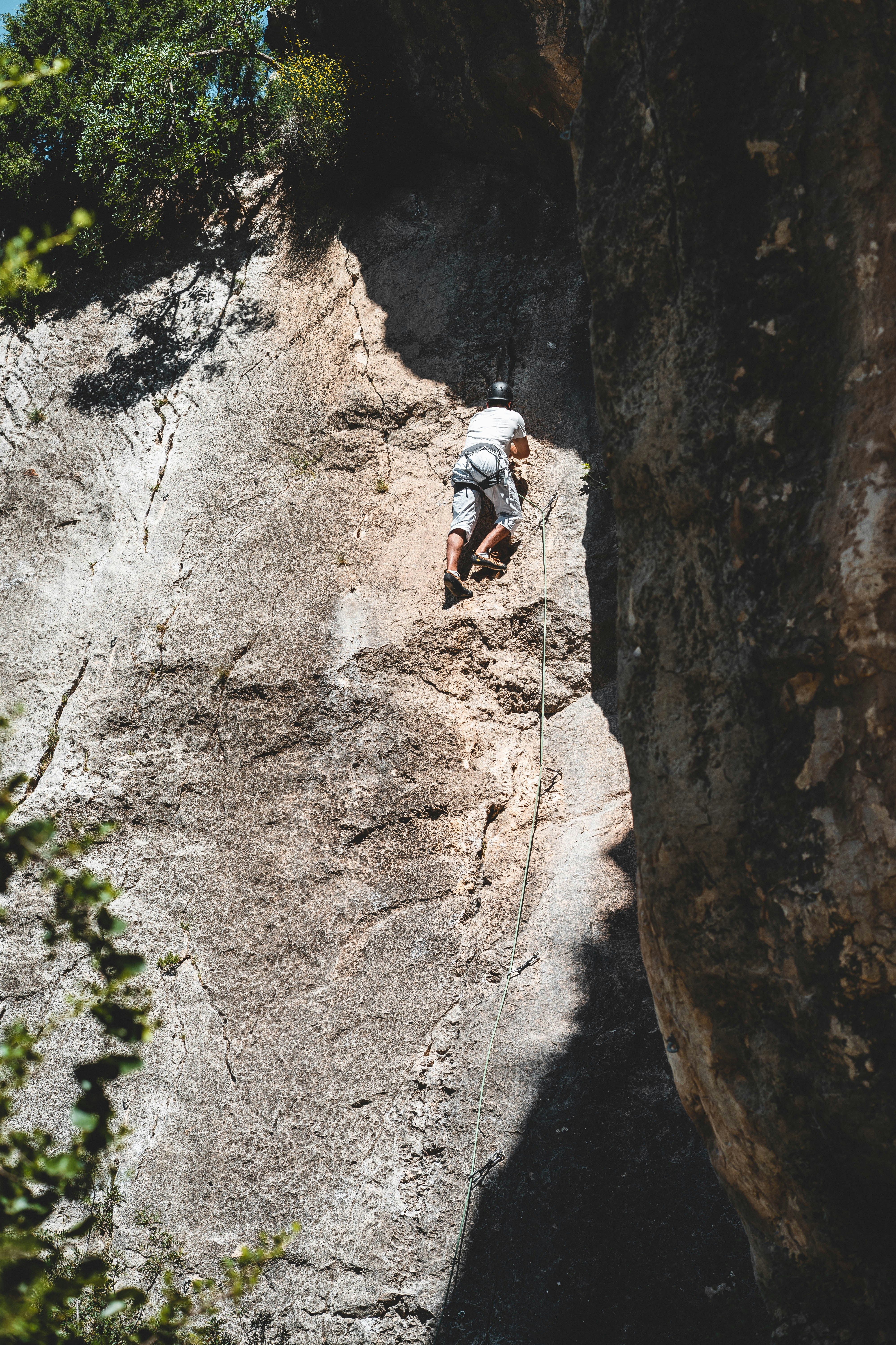 Edge of Granite: Climber Ascends a Sunlit Crag