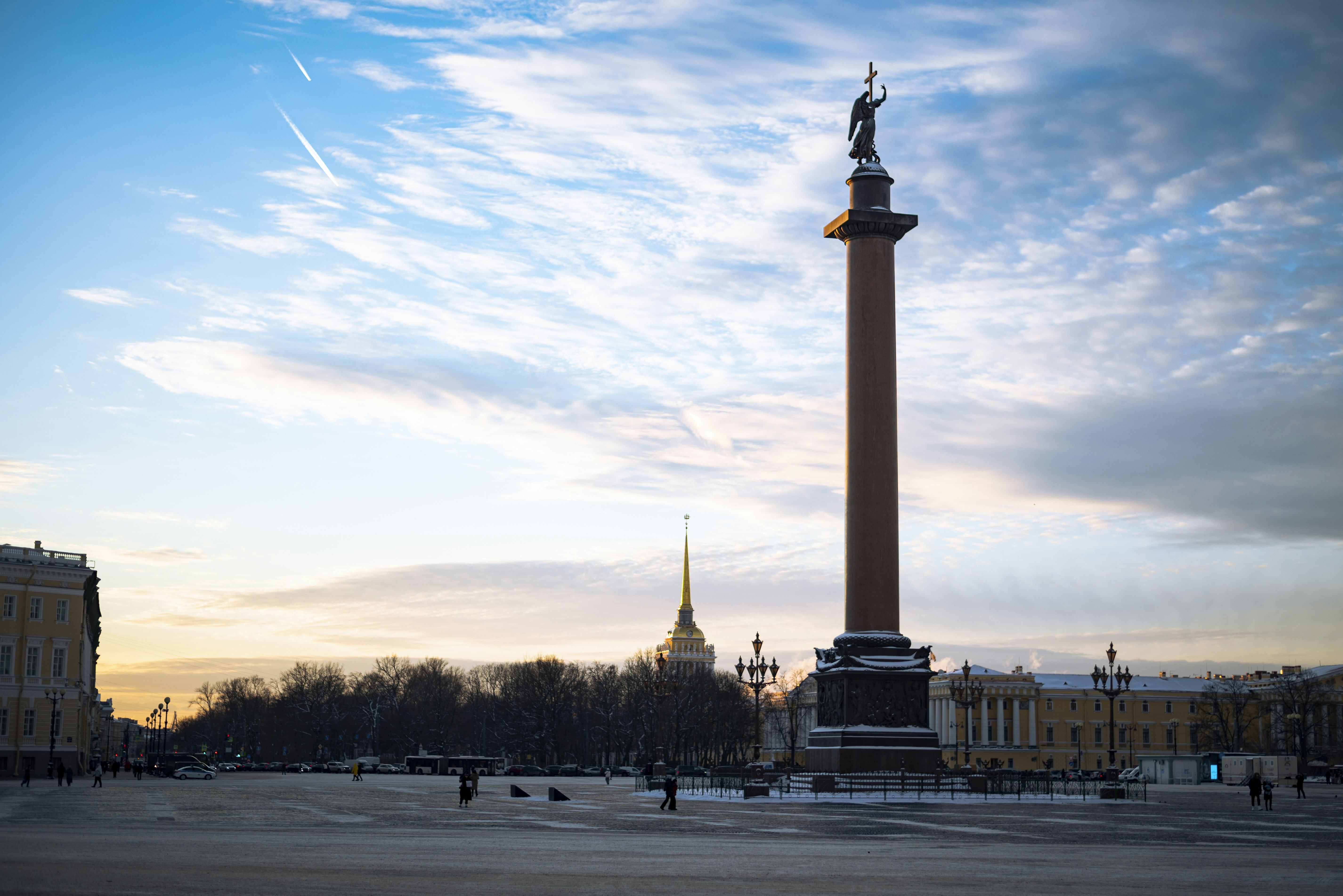 Alexander Column standing tall against a dramatic sky at sunrise.