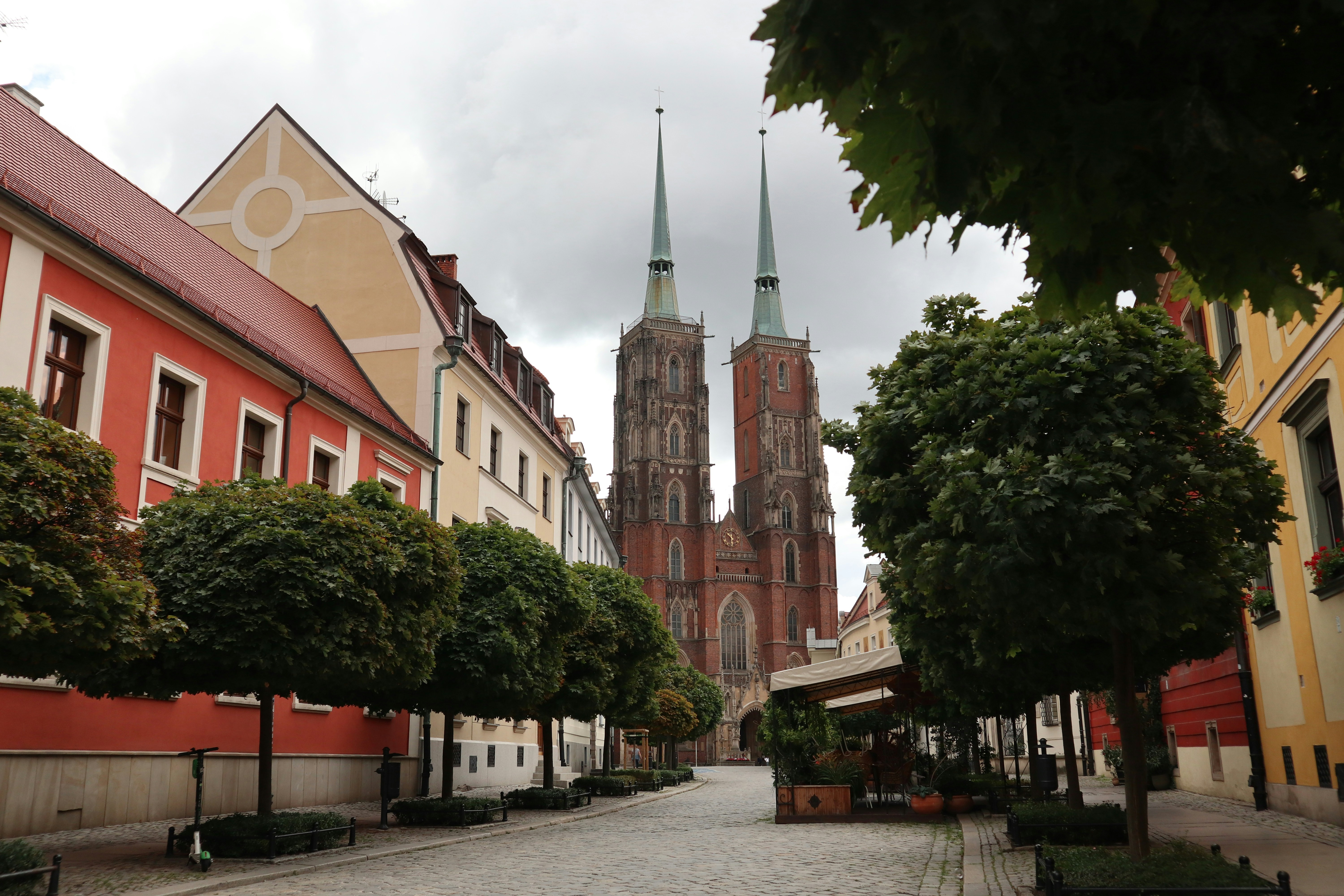 Twin Spires on a Cobblestone Avenue: Framing a Gothic Cathedral