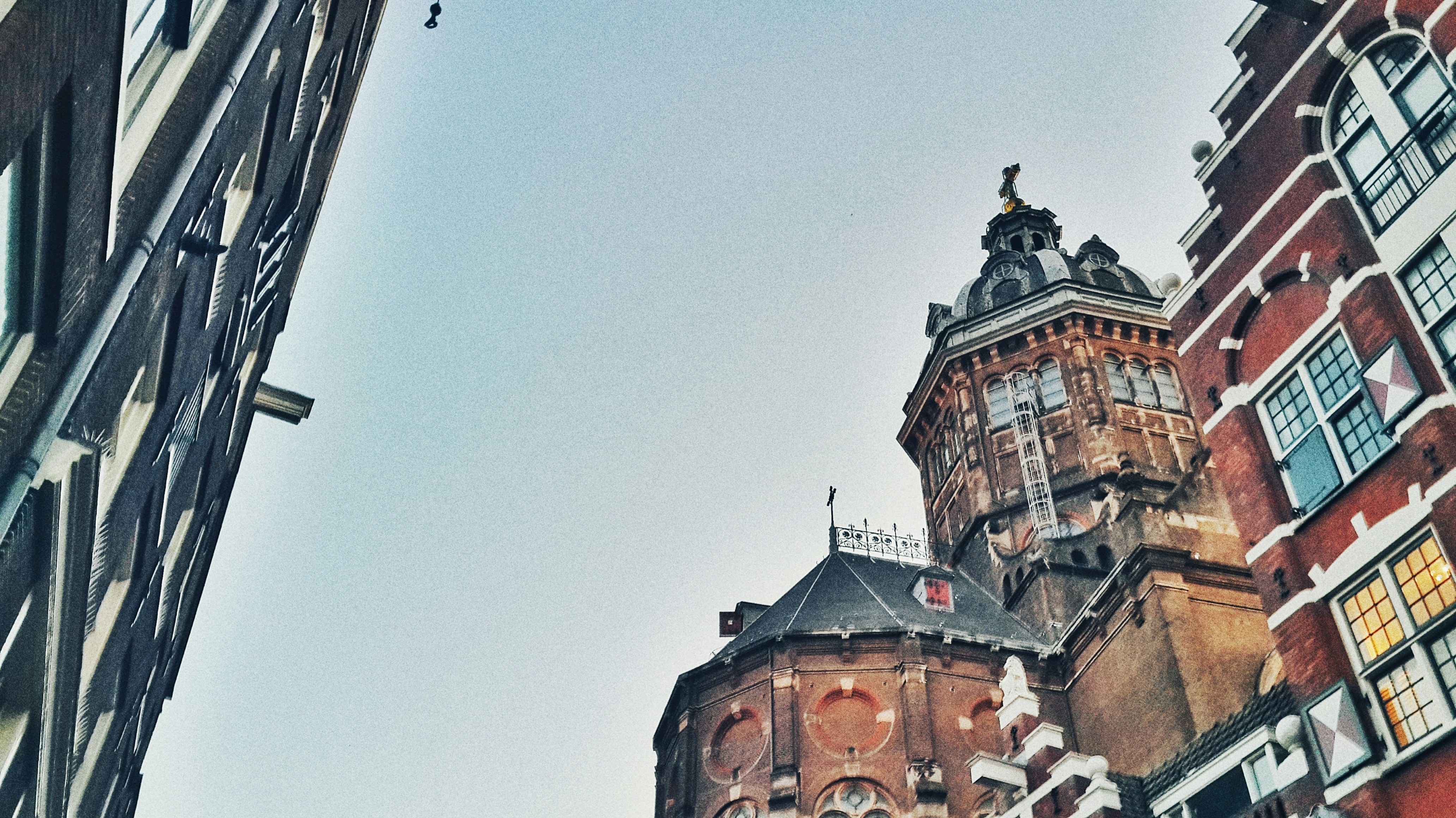 Brick Clocktower Amid Narrow European Facades
