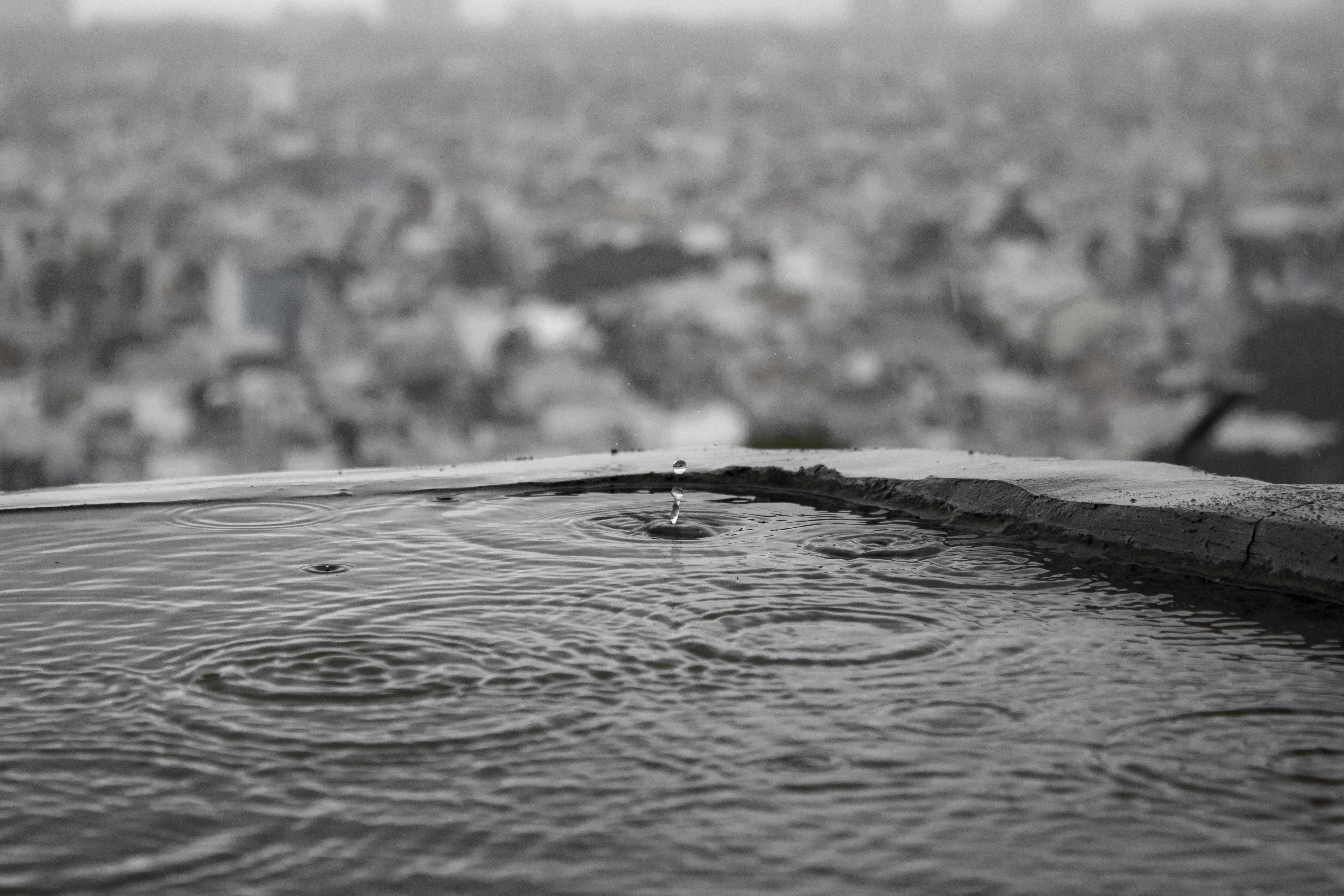 Rooftop Ripples: A Solitary Drop Echoes Across the City