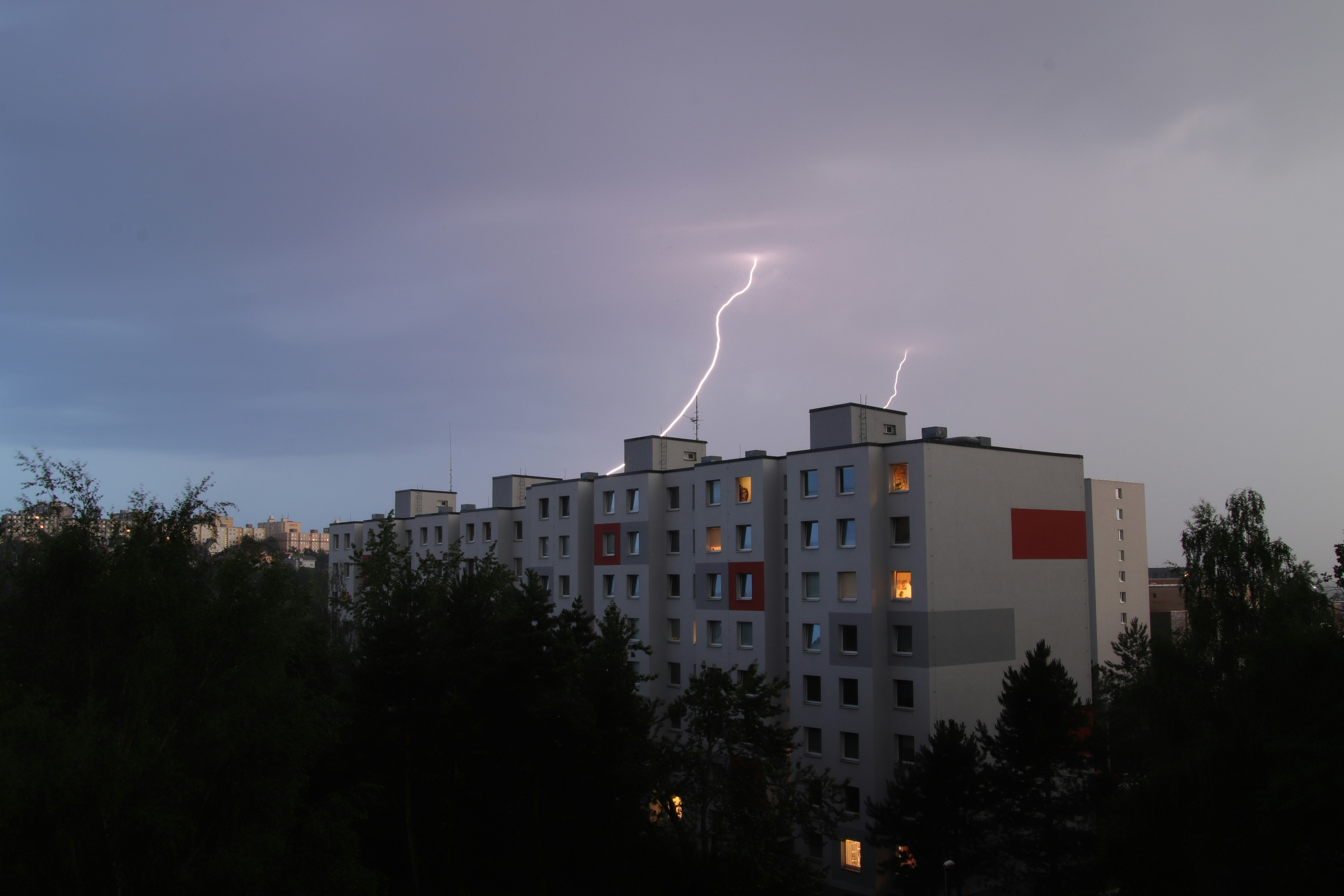 A building with a lightning bolt in the sky photo – Free Nature Image ...