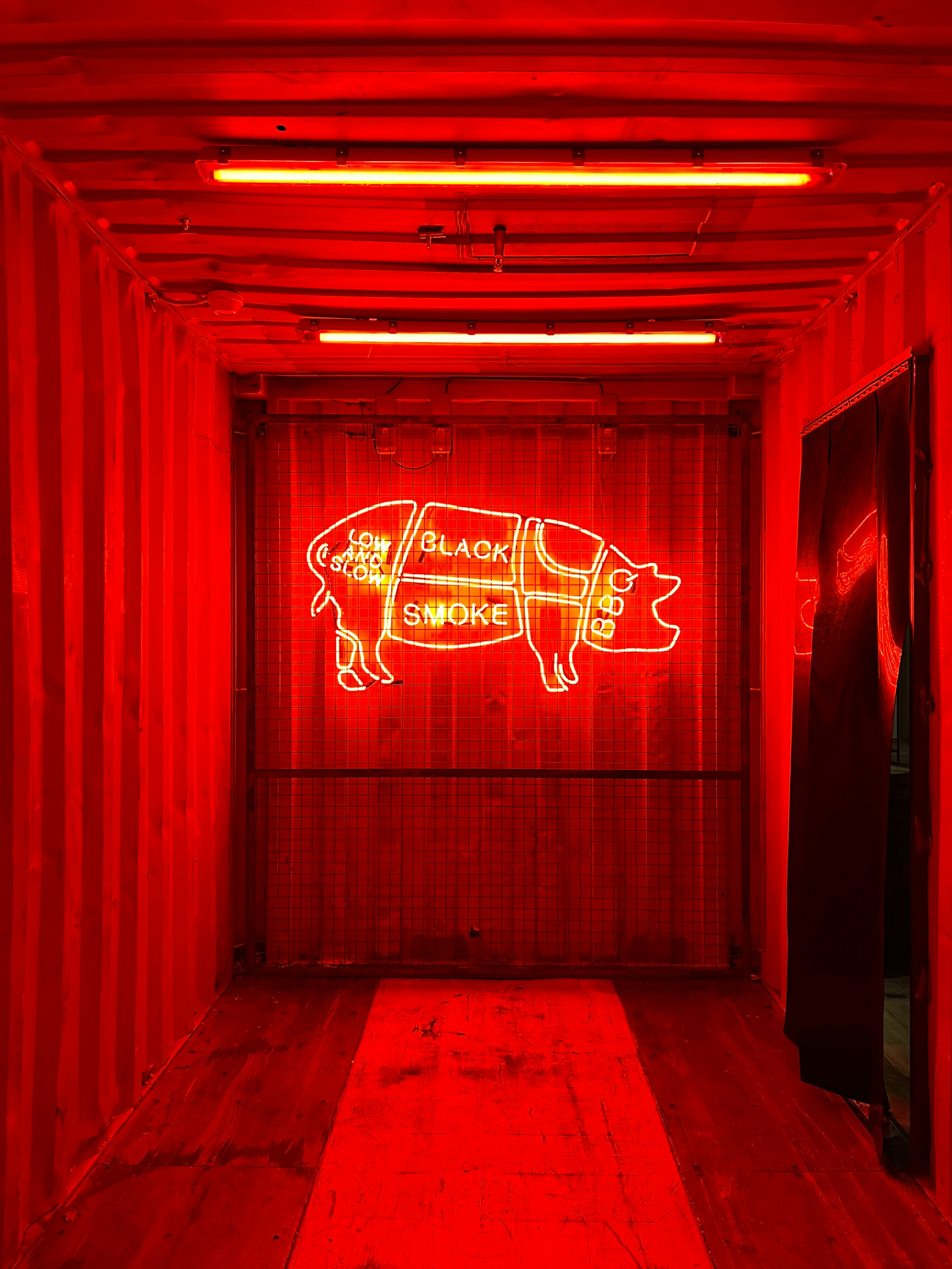 A red door with a lighted sign photo – Free Food Image on Unsplash