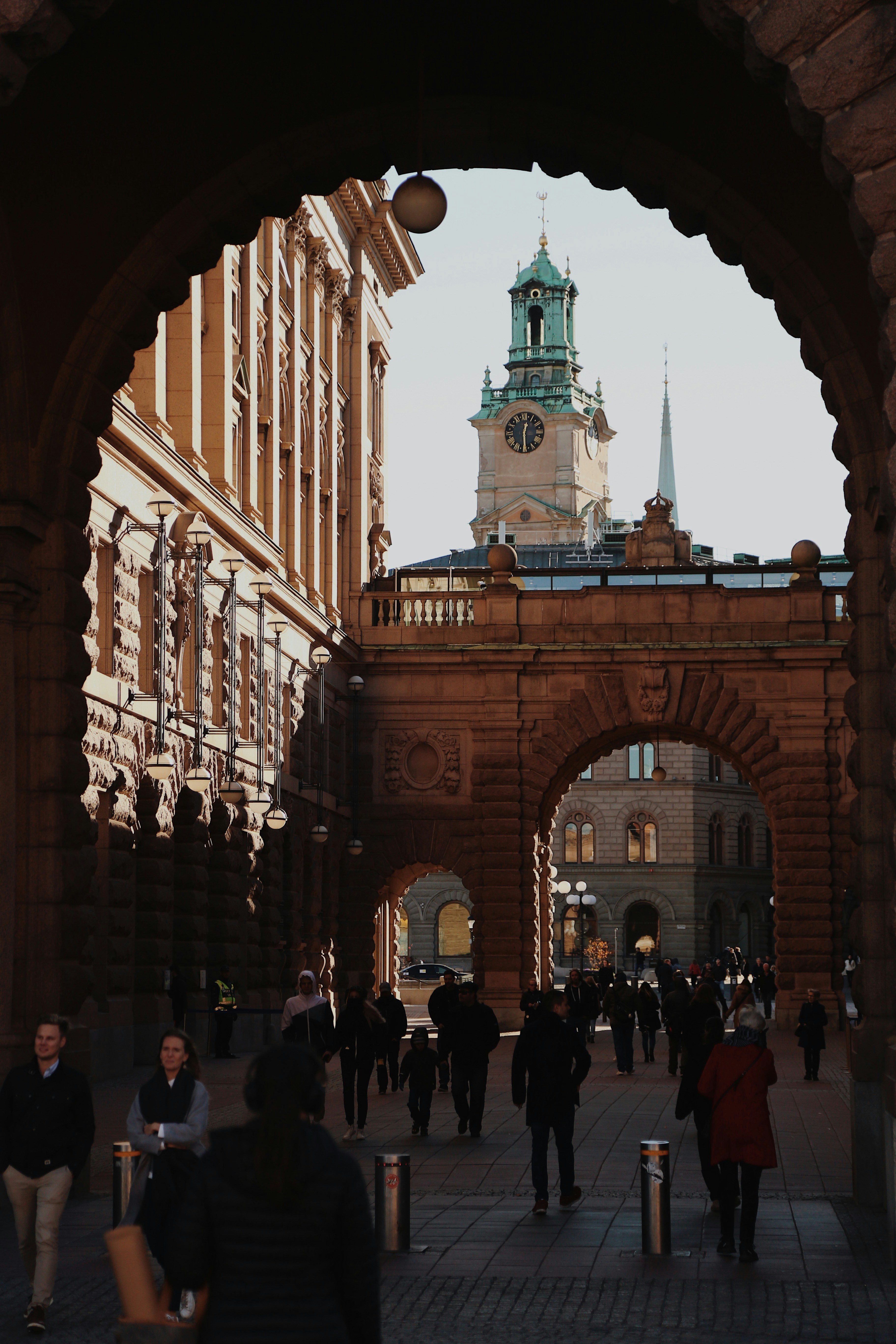 Through the Arch, a Clock Tower Emerges